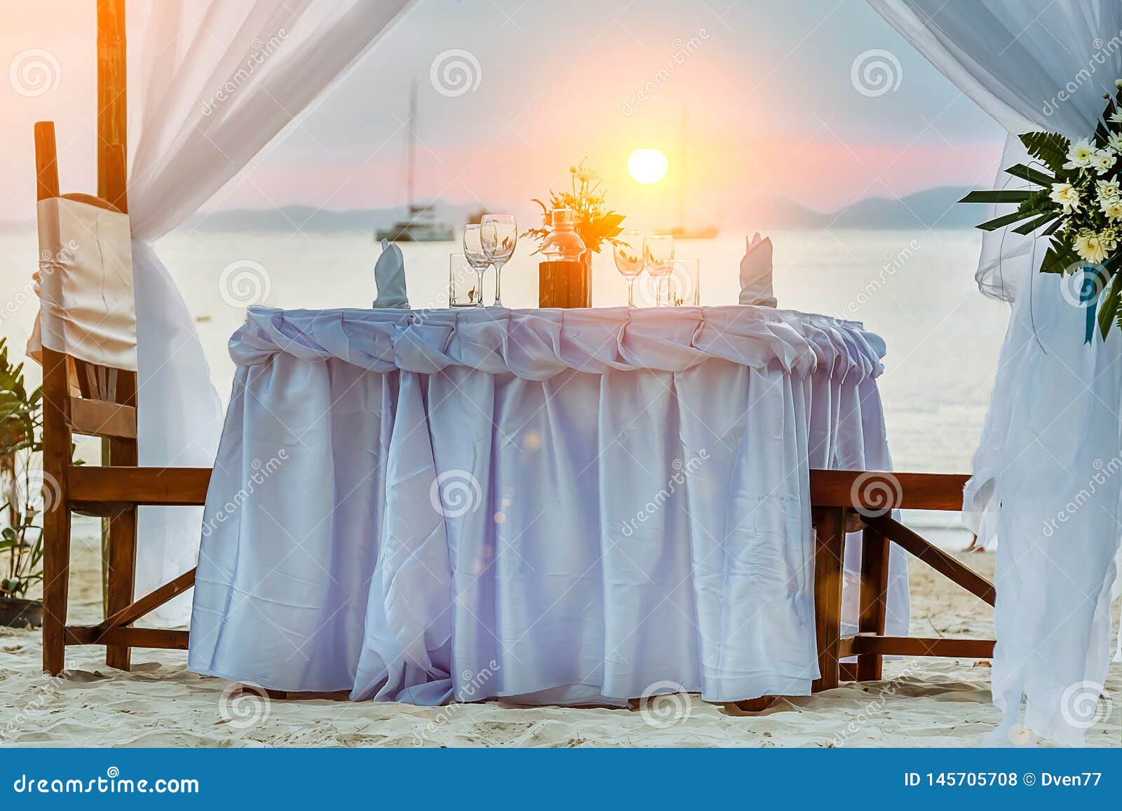 Romantic Dinner Table on the Tropical Beach, during Sunset, Ships in ...