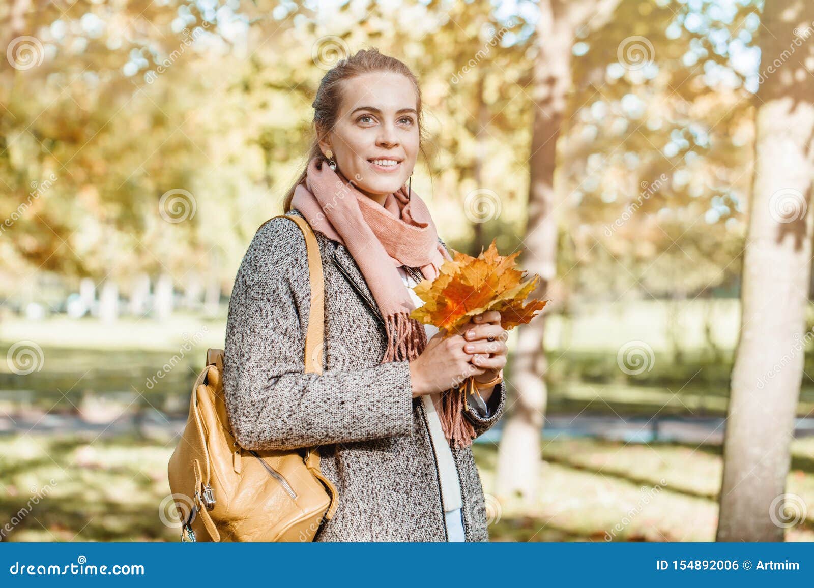 Romantic Girl Dreams In Fall Park Beautiful Autumn Woman Holding