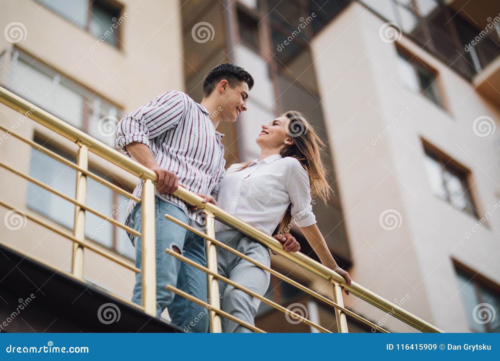 Lovely Happy Couple Relax And Have Fun At Balcony In Their New Home