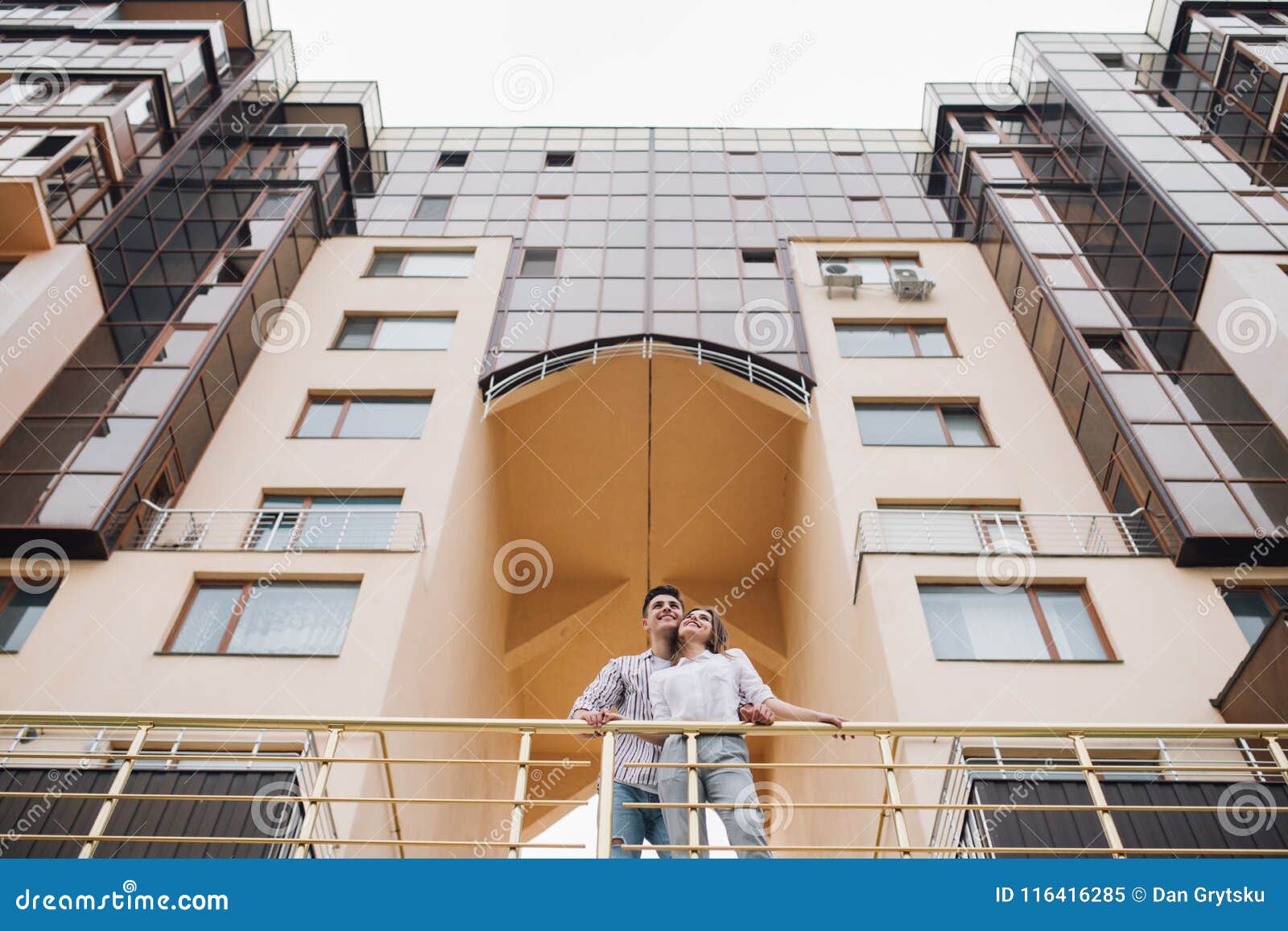 Lovely Happy Couple Relax And Have Fun At Balcony In Their New Home