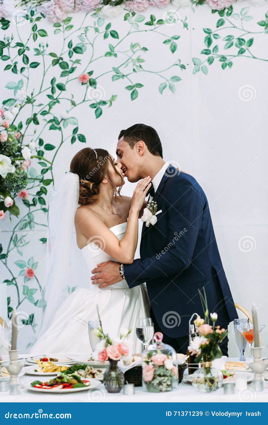 Romantic Kiss of the Married Couple Next To the Table Stock Image ...