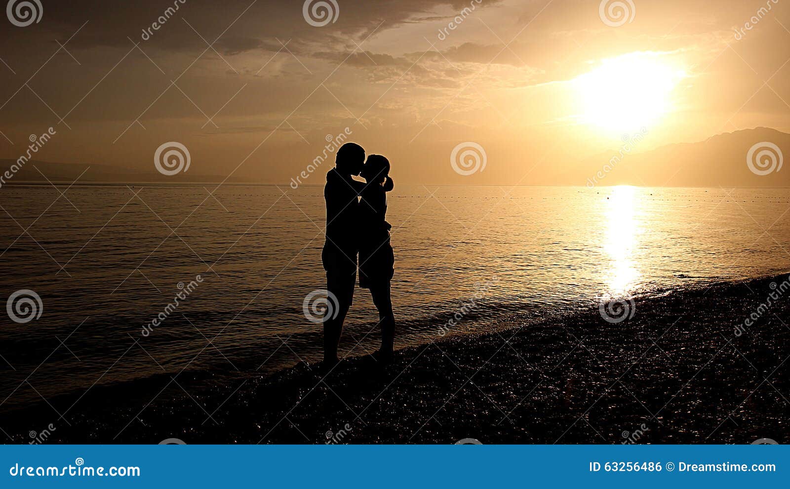 Romantic Kiss at Sunset by the Sea Stock Photo - Image of sunset ...