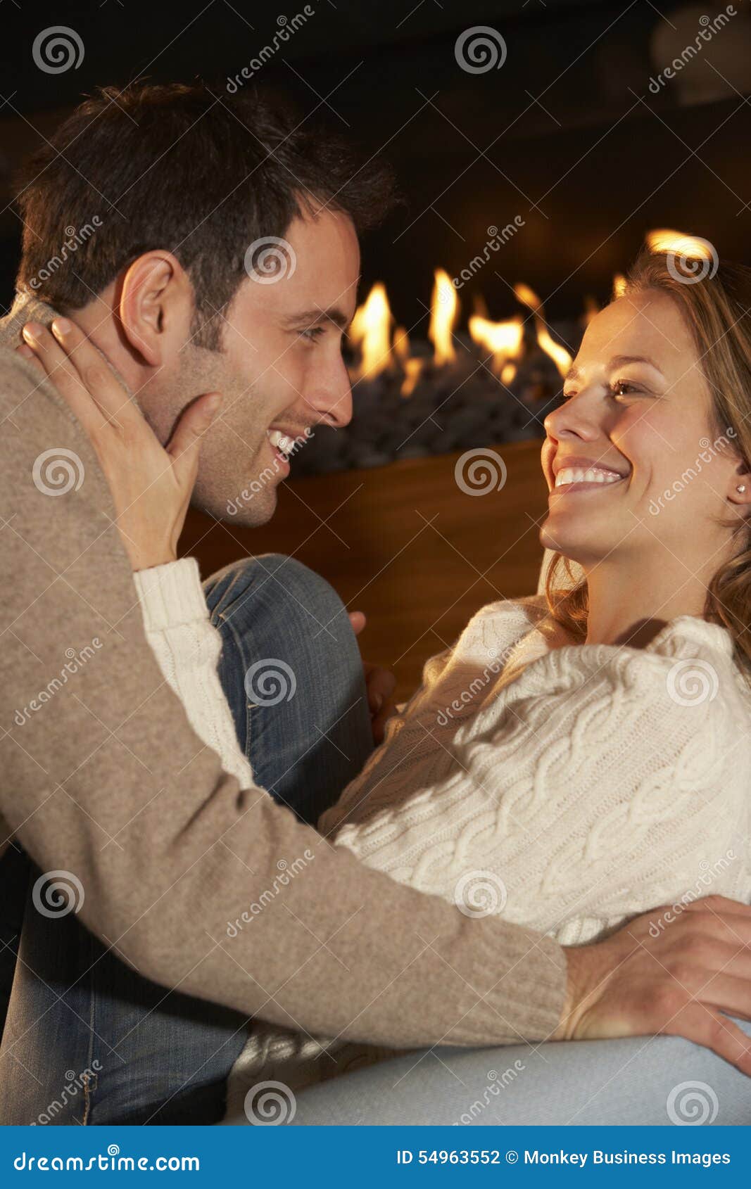 Romantic Portrait Couple in Front of Fire Stock Photo - Image of loving ...