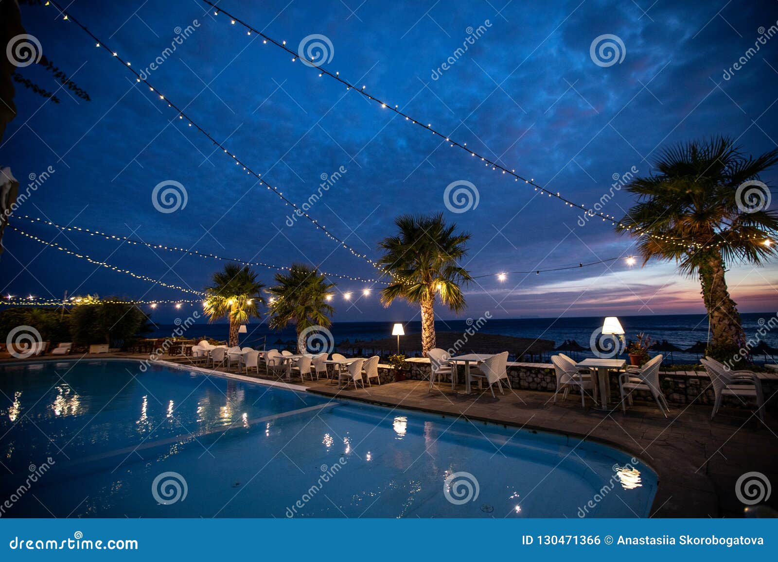 Romantic Restaurant by the Pool at Night Stock Photo - Image of ...