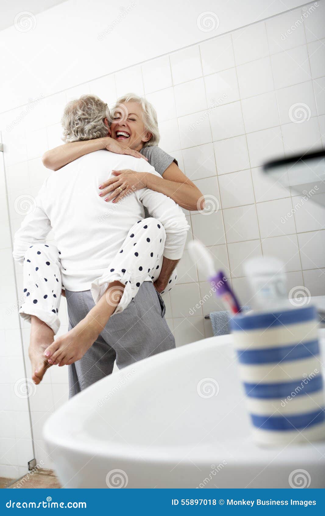 Romantic Senior Couple in Bathroom Stock Photo - Image of morning ...