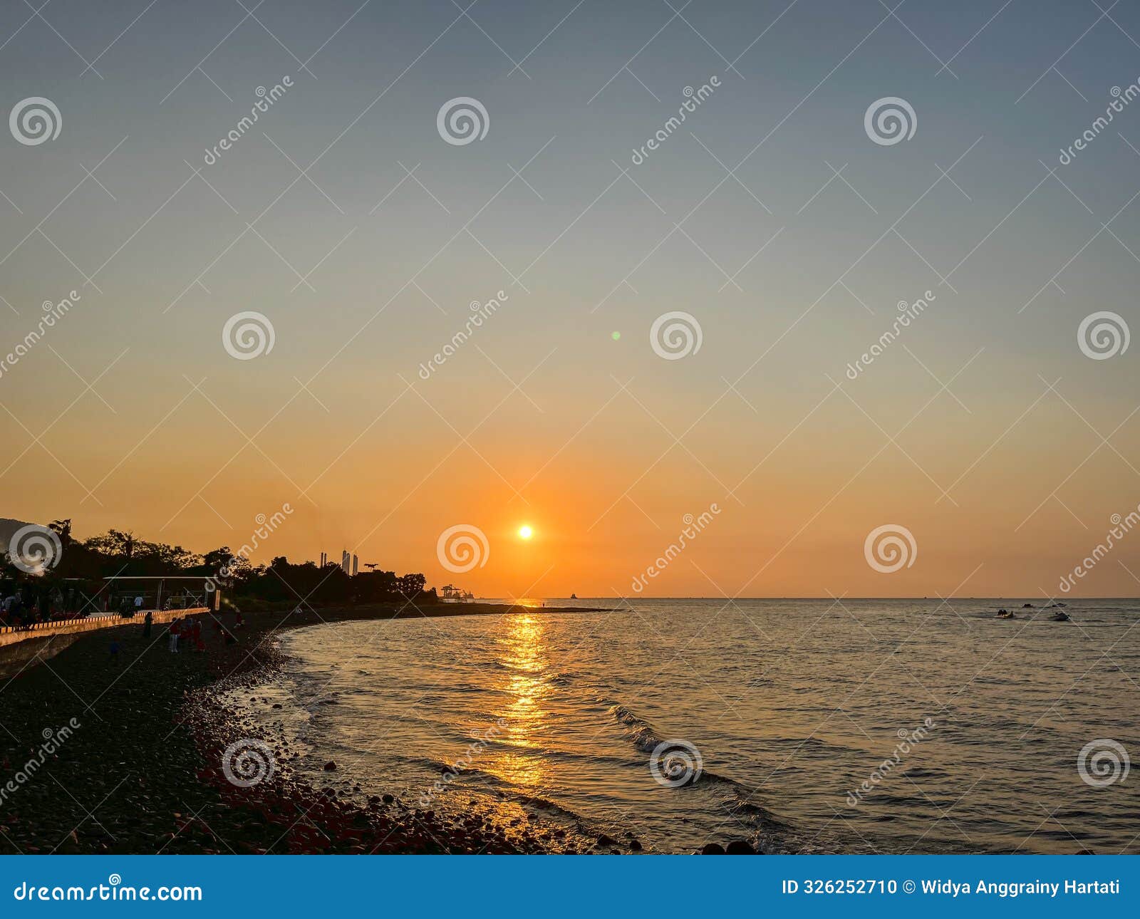 Sunset in the beach stock photo. Image of cloudscape - 326252710