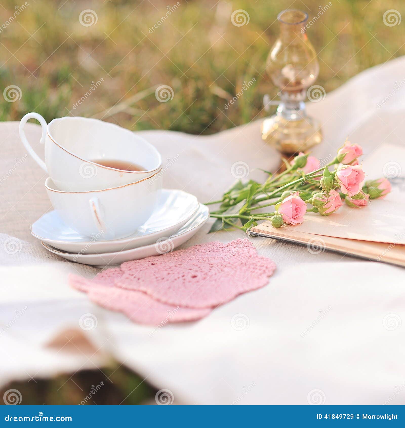 Romantic tea time outdoors stock image. Image of dishes - 41849729