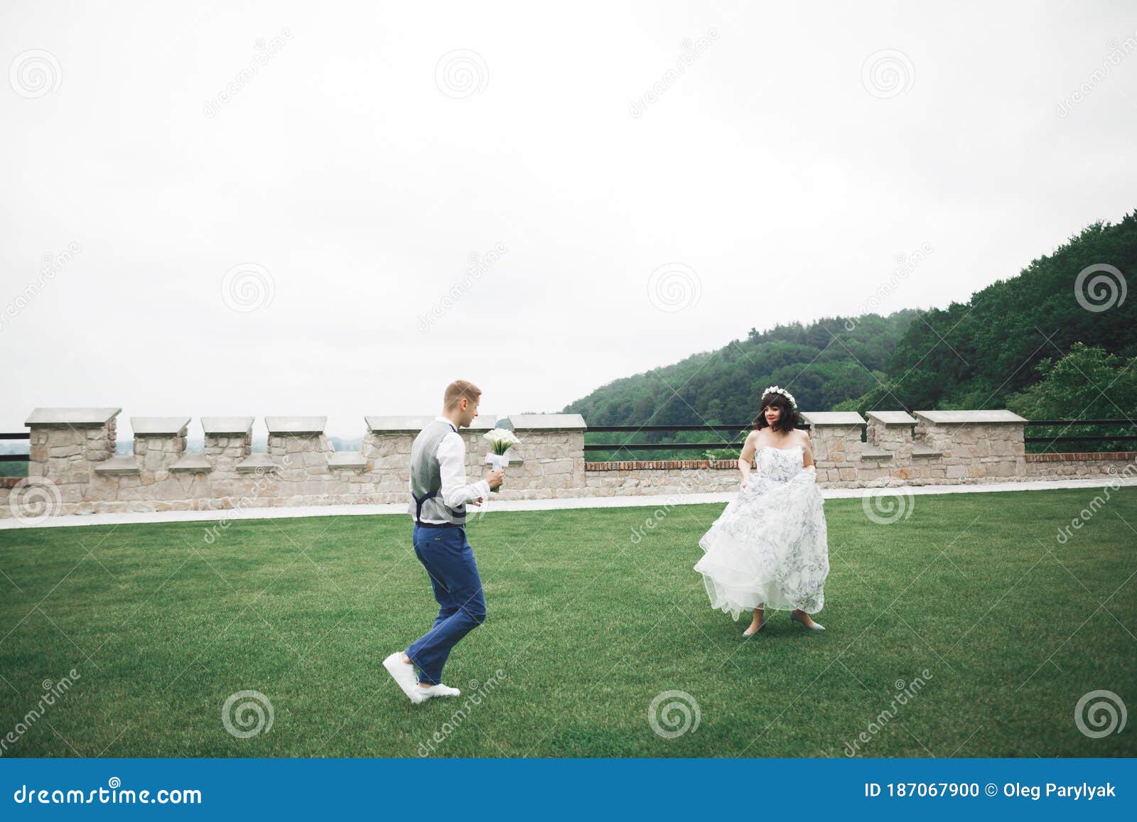Romantic Wedding Moment, Bride Running from Groom in a Park Stock Photo ...