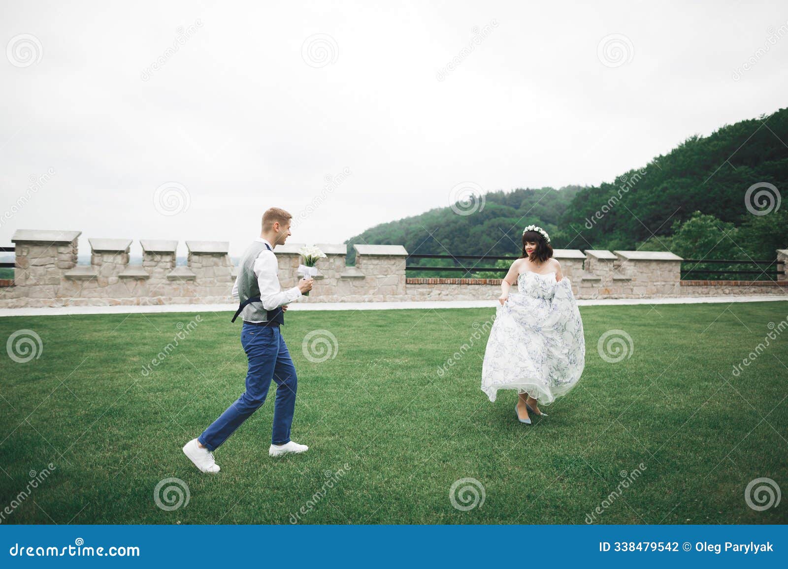 Romantic Wedding Moment, Bride Running from Groom in a Park Stock Photo ...
