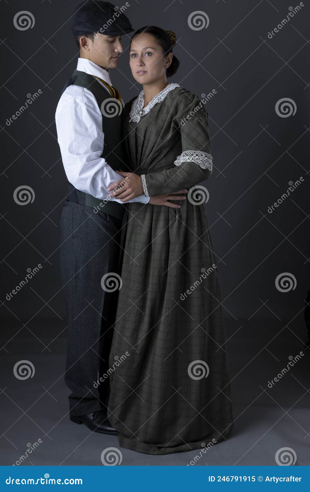 A Romantic Working Class Victorian Couple Standing Together Against a ...
