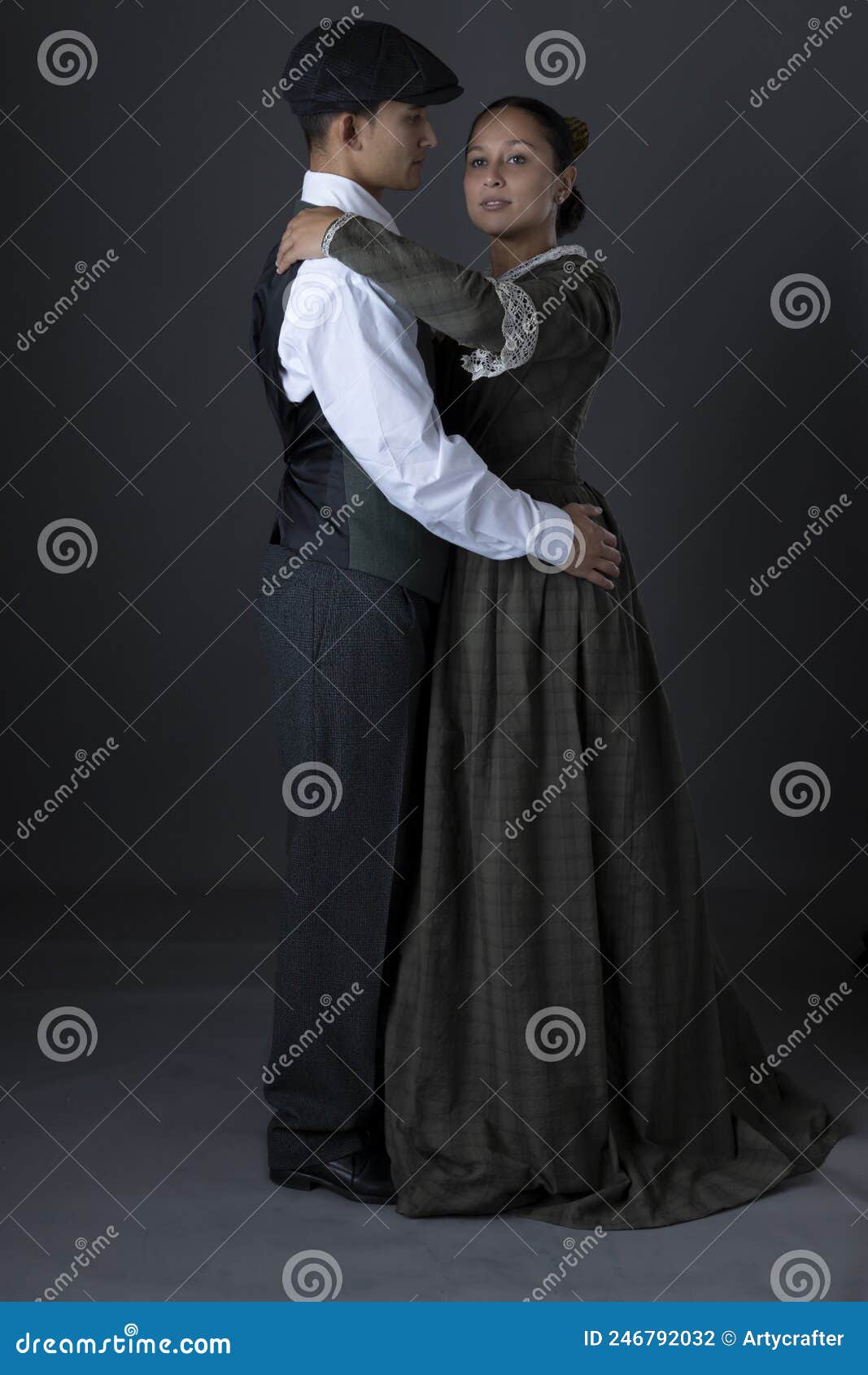 A Romantic Working Class Victorian Couple Standing Together Against a ...