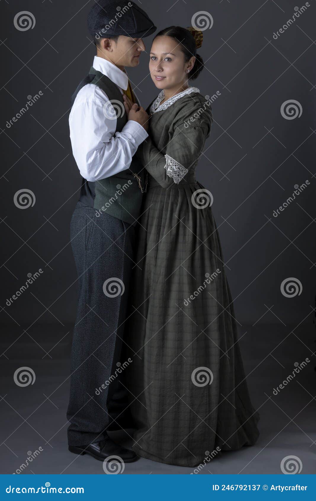A Romantic Working Class Victorian Couple Standing Together Against a ...