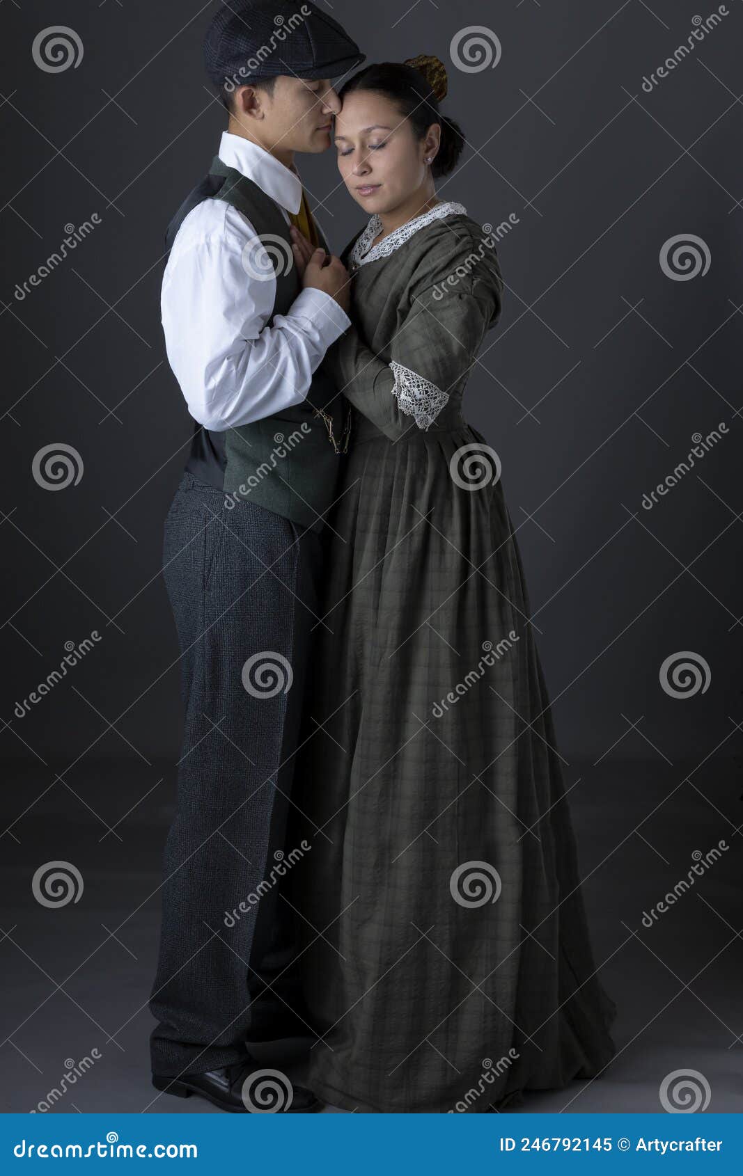 A Romantic Working Class Victorian Couple Standing Together Against a ...