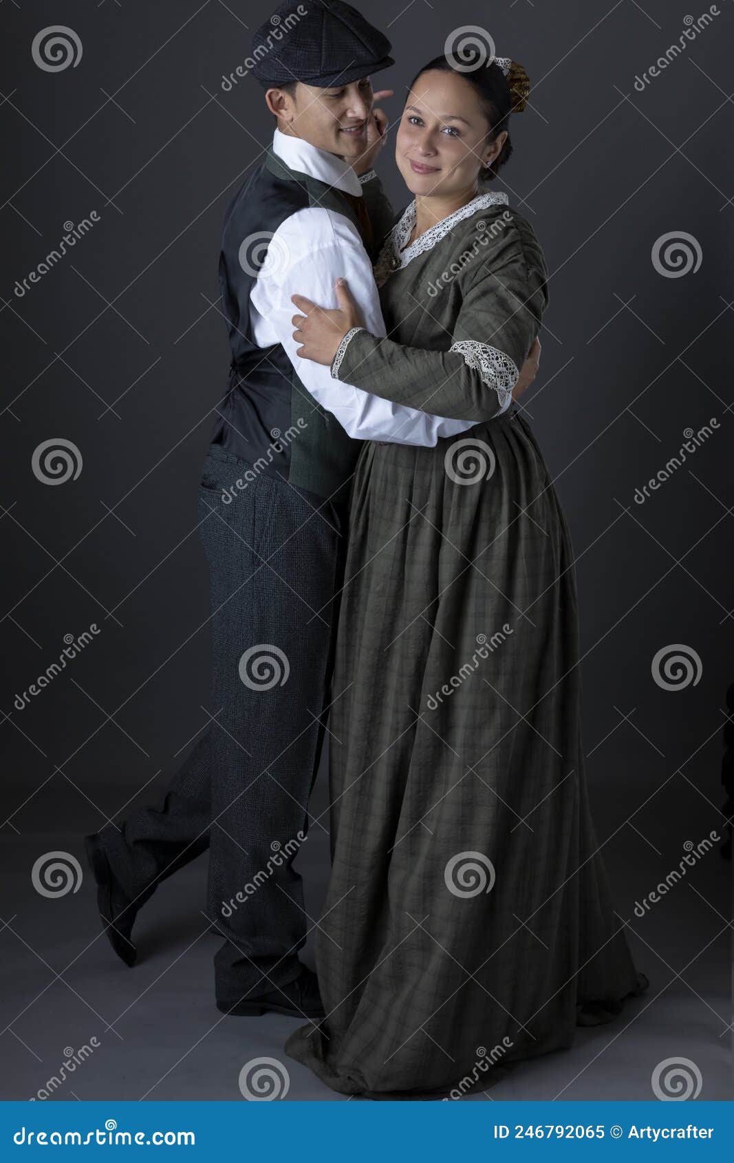A Romantic Working Class Victorian Couple Standing Together Against a ...