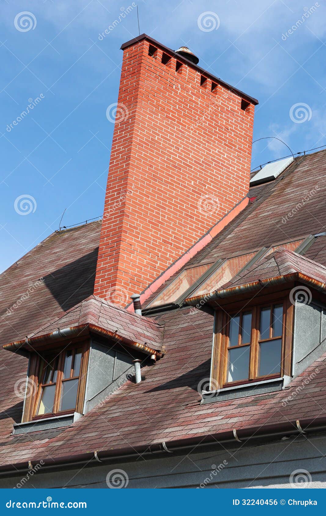 Roof with Brick Chimney and Two Vertical Windows Stock Photo - Image of ...