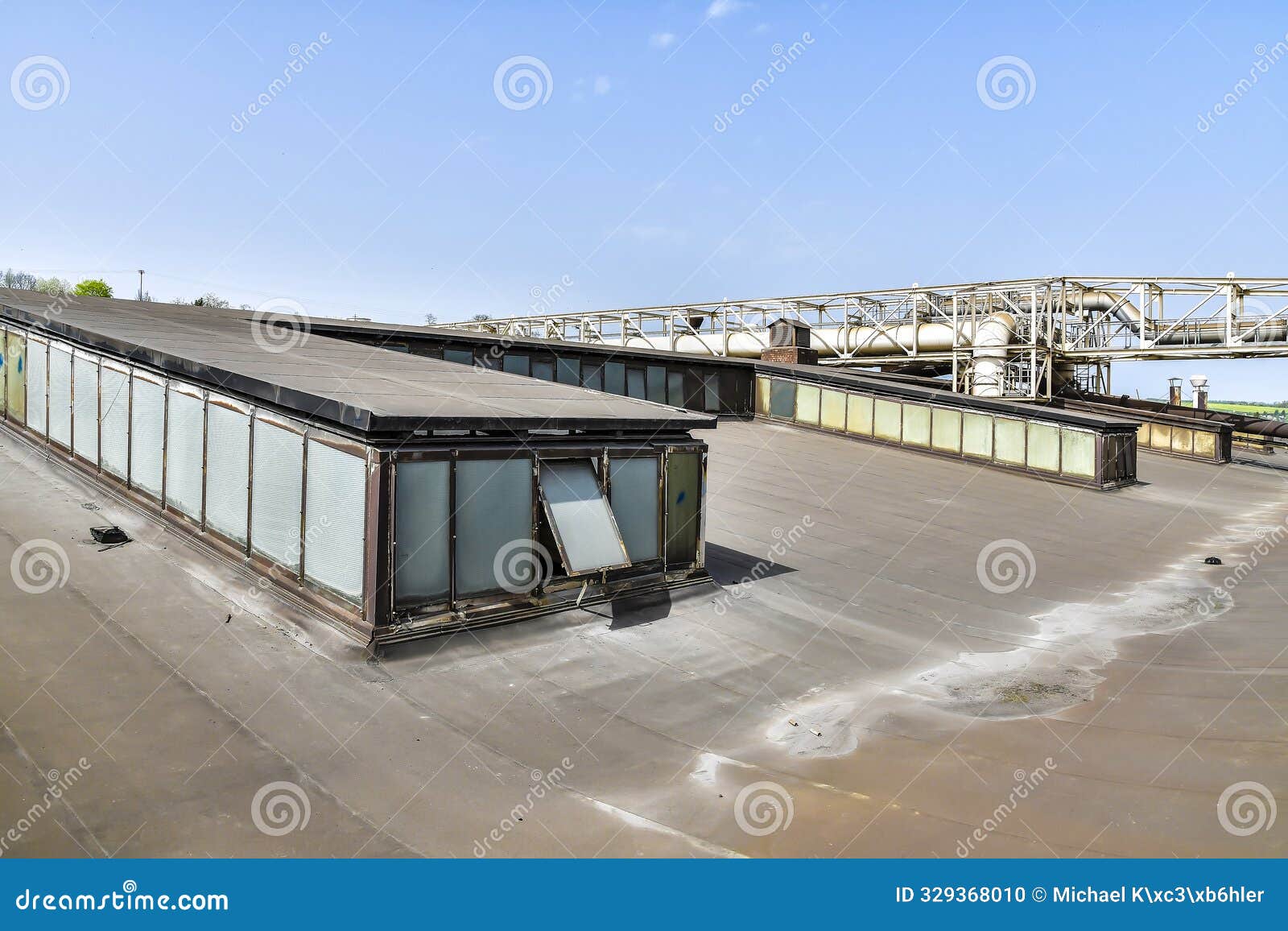 The Rooftop of a Building Features Graffiti that Includes Several ...