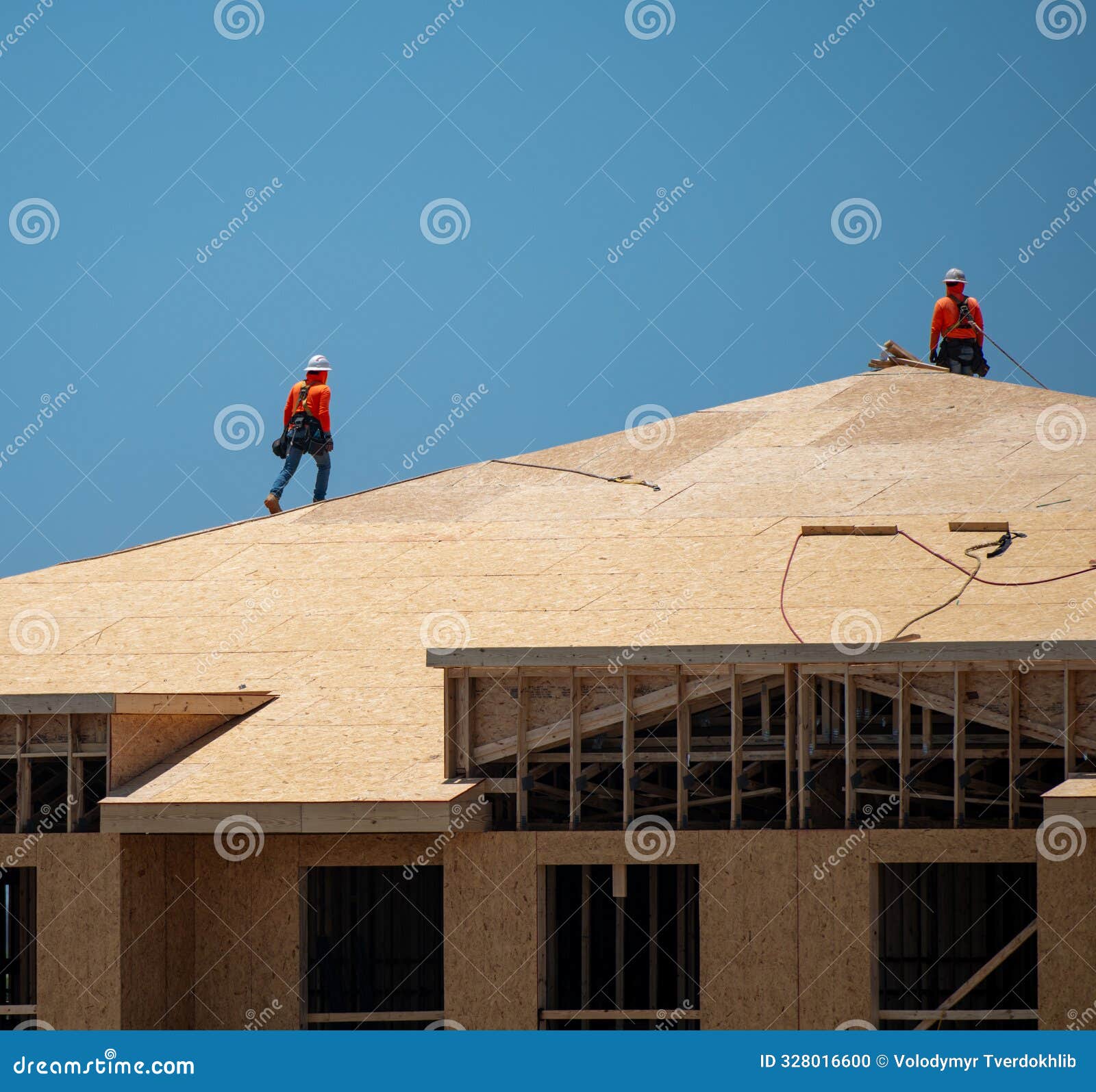 Roof Construction. Roofer on Roof Structure. Construction Worker on Top ...