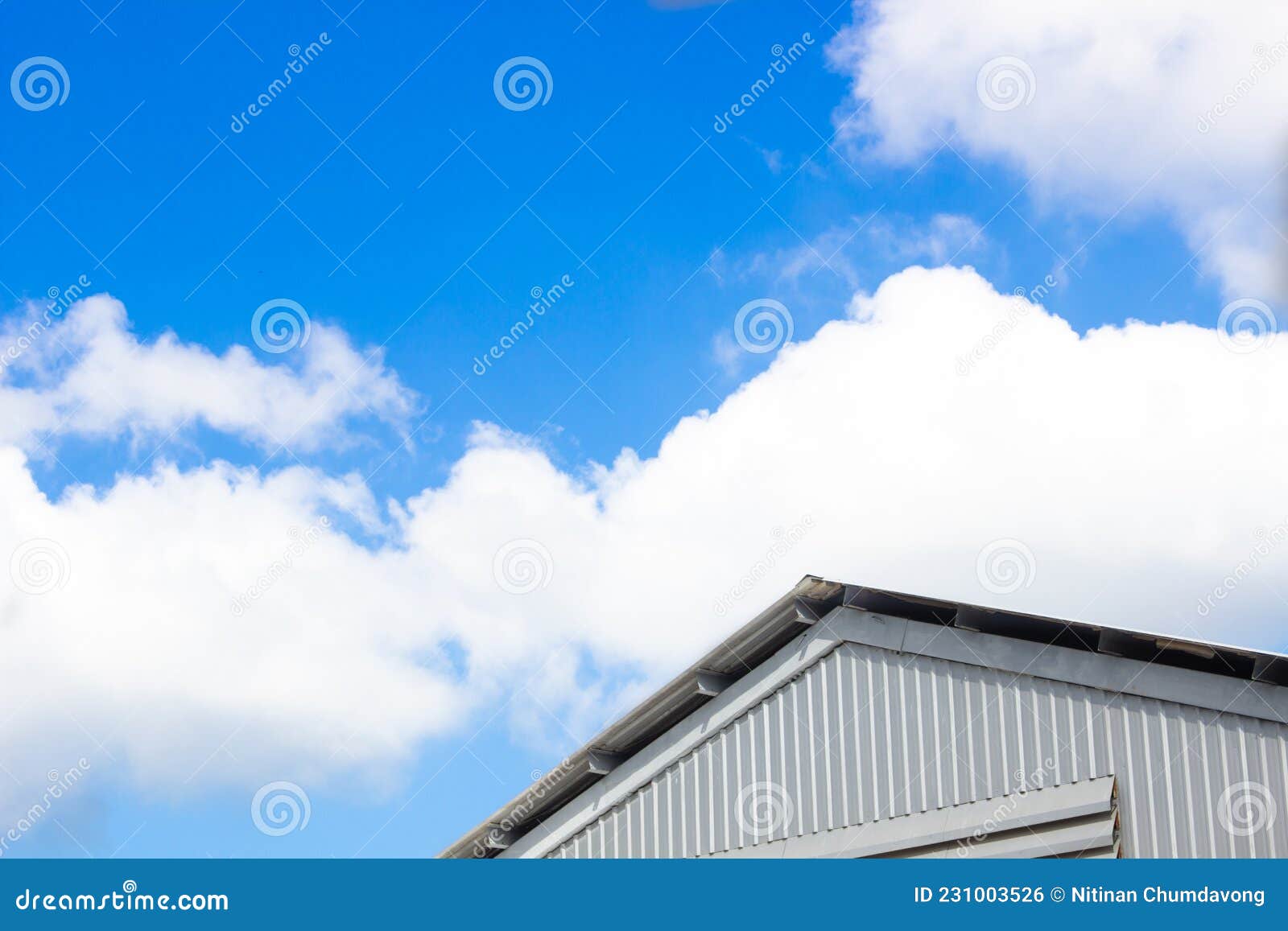 A Roof Corner Of A Brick House Covered With Asphalt Shingles With A ...