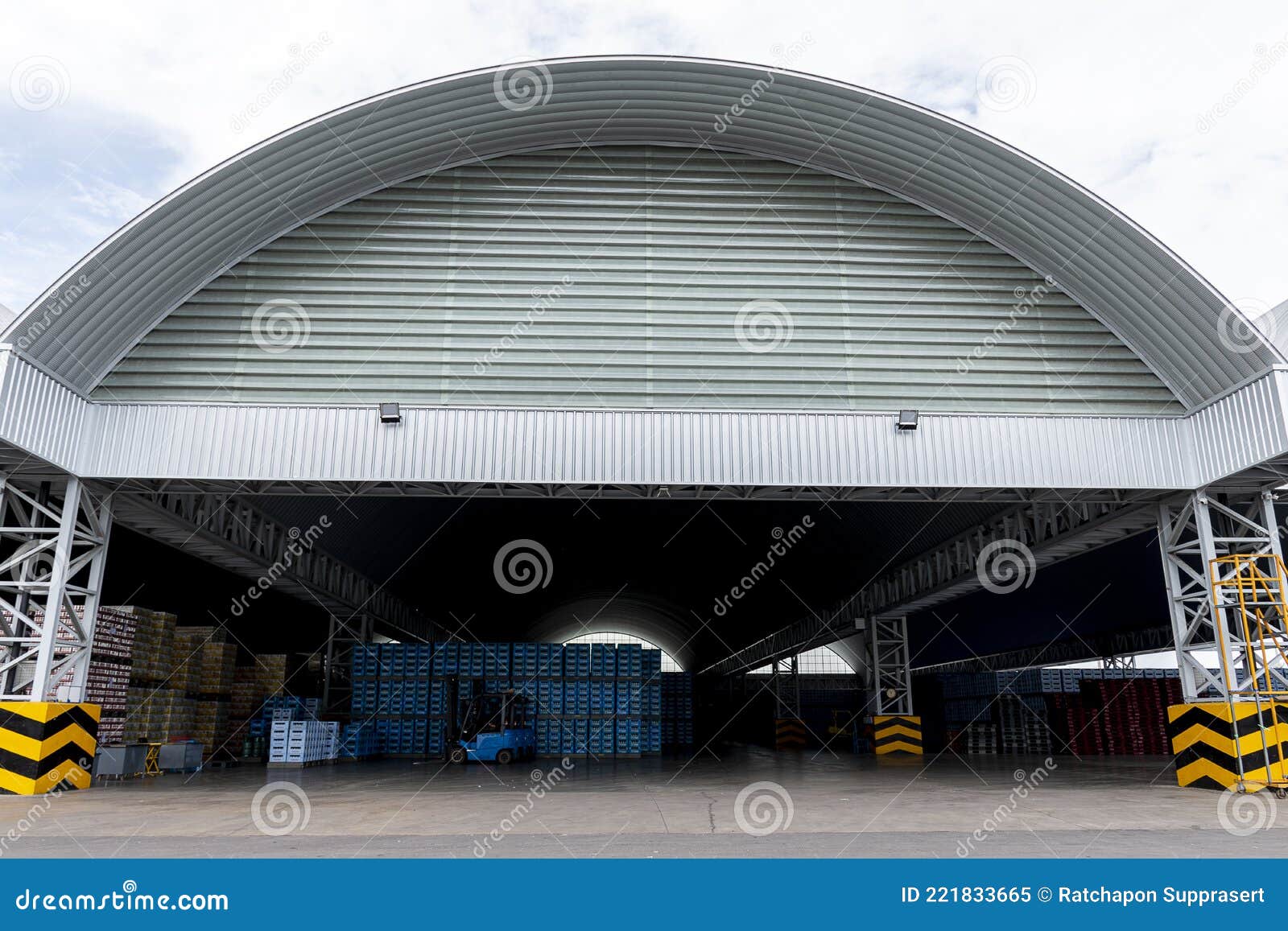 Large Distribution Warehouse In The Background Behind A Latticed Fence ...