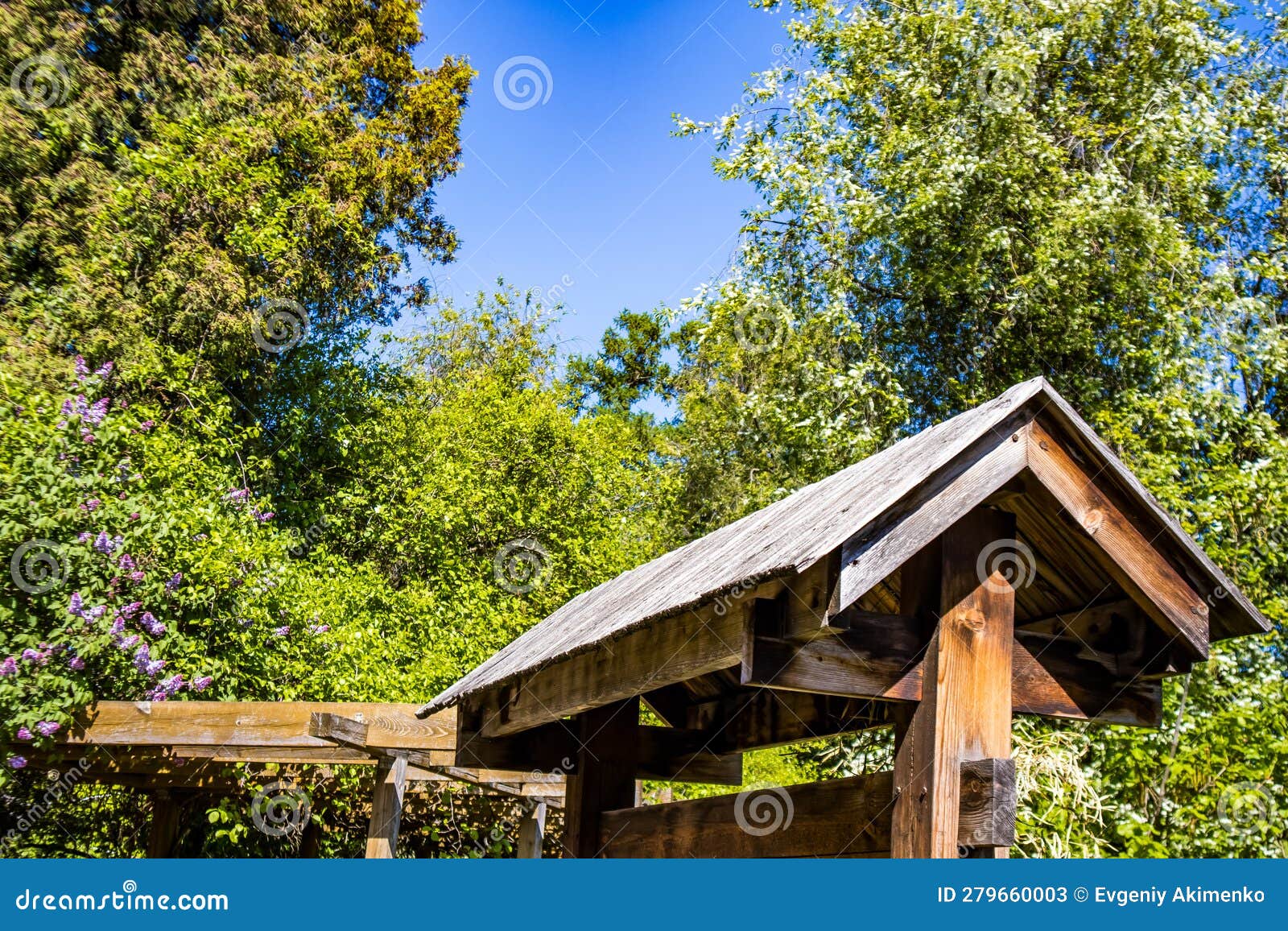 Roof of a well in the park stock image. Image of wooden - 279660003