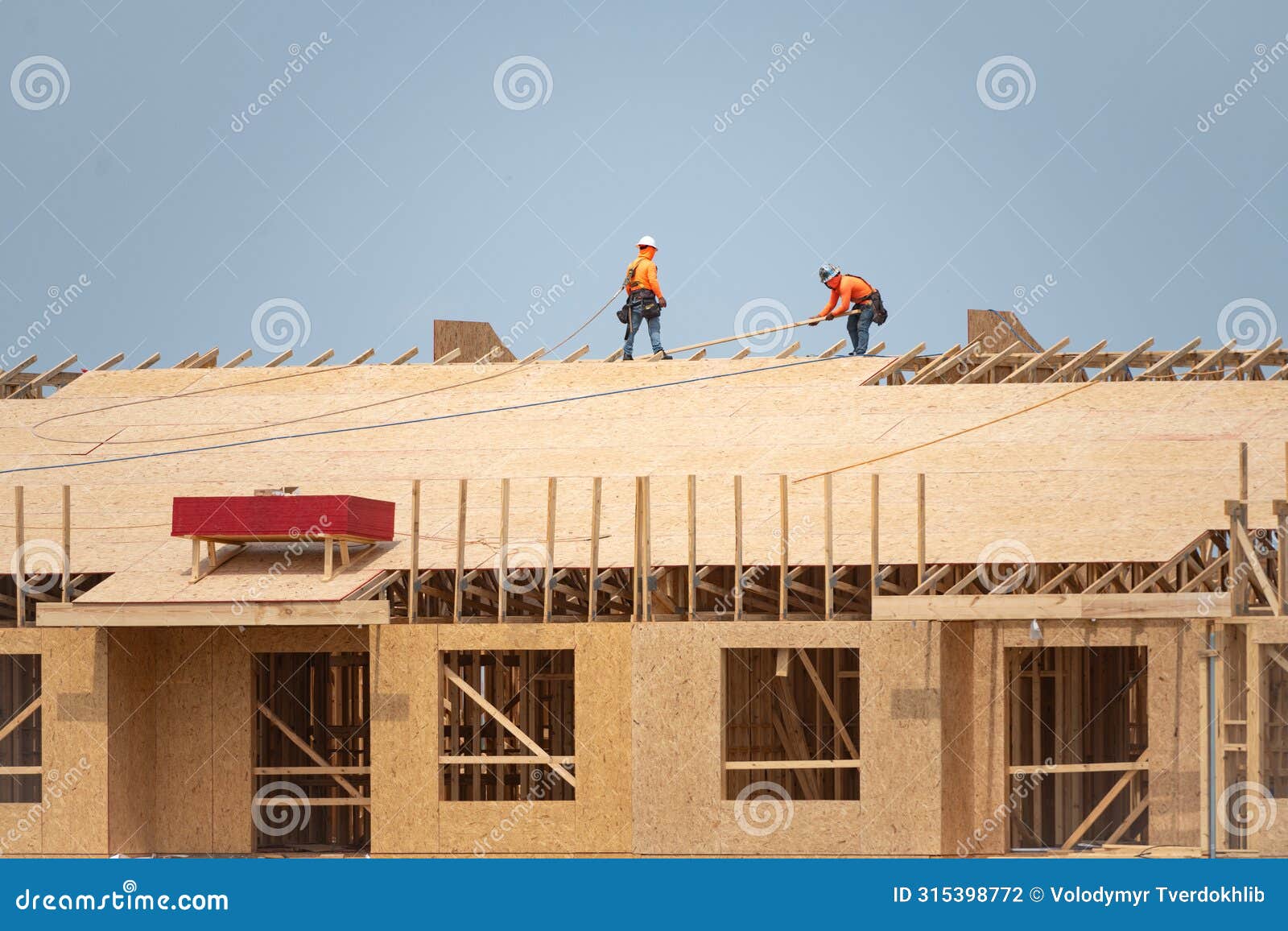 Roofer Builder Roofing on the Roof Structure. Stock Photo - Image of ...