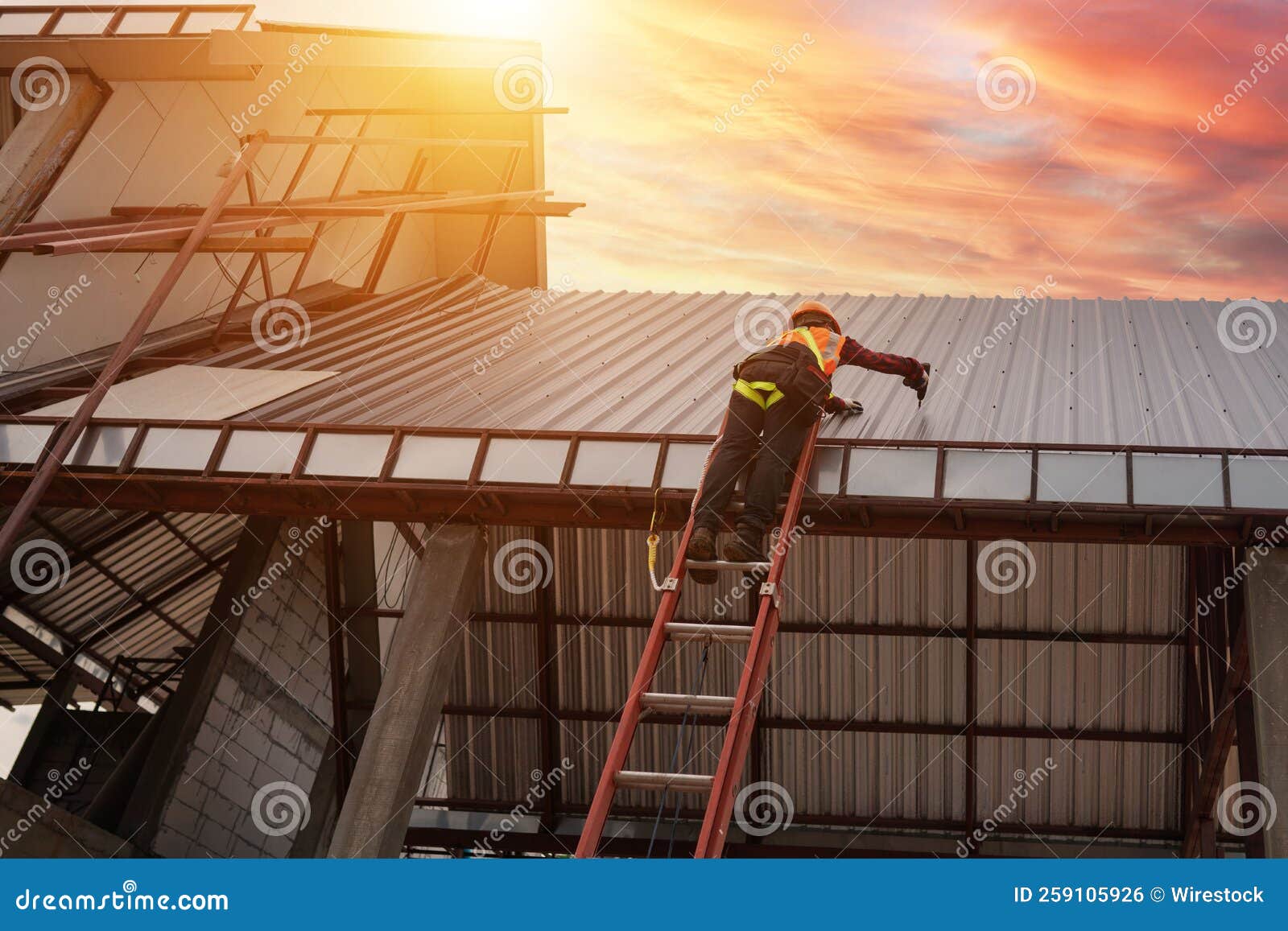Roofer Installing Metal Sheet and Wear Safety Uniform Working on Stock ...