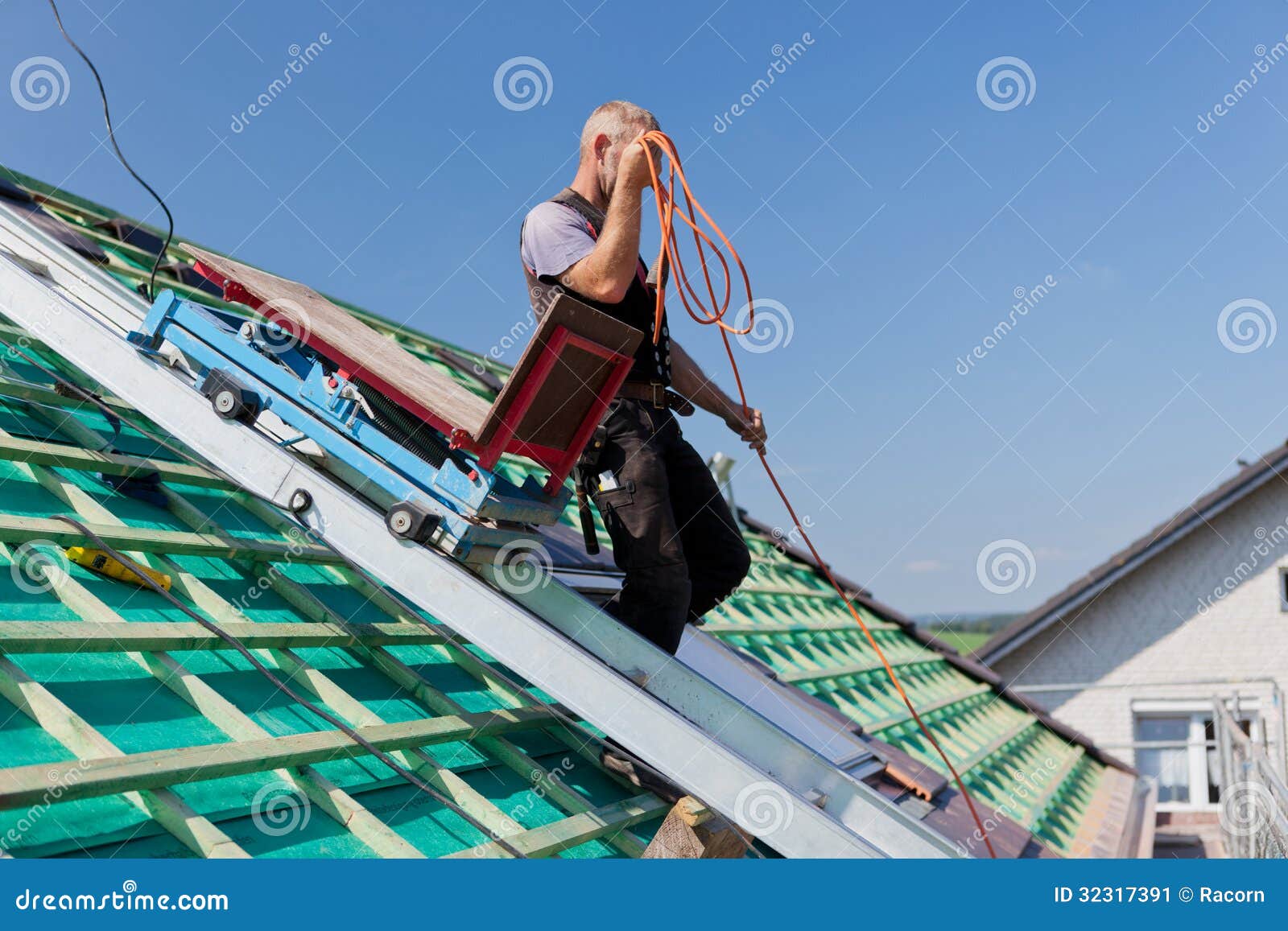 Roofer using the elevator stock image. Image of repair - 32317391