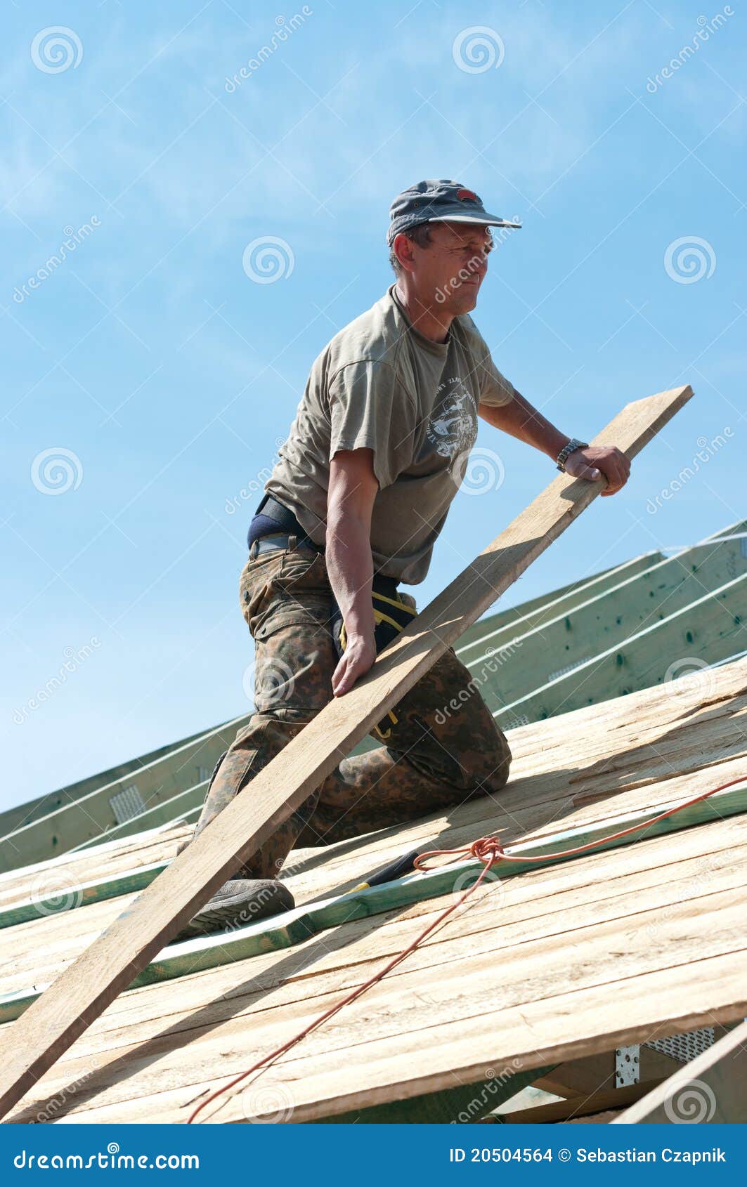 Roofer at work on building stock photo. Image of copy - 20504564