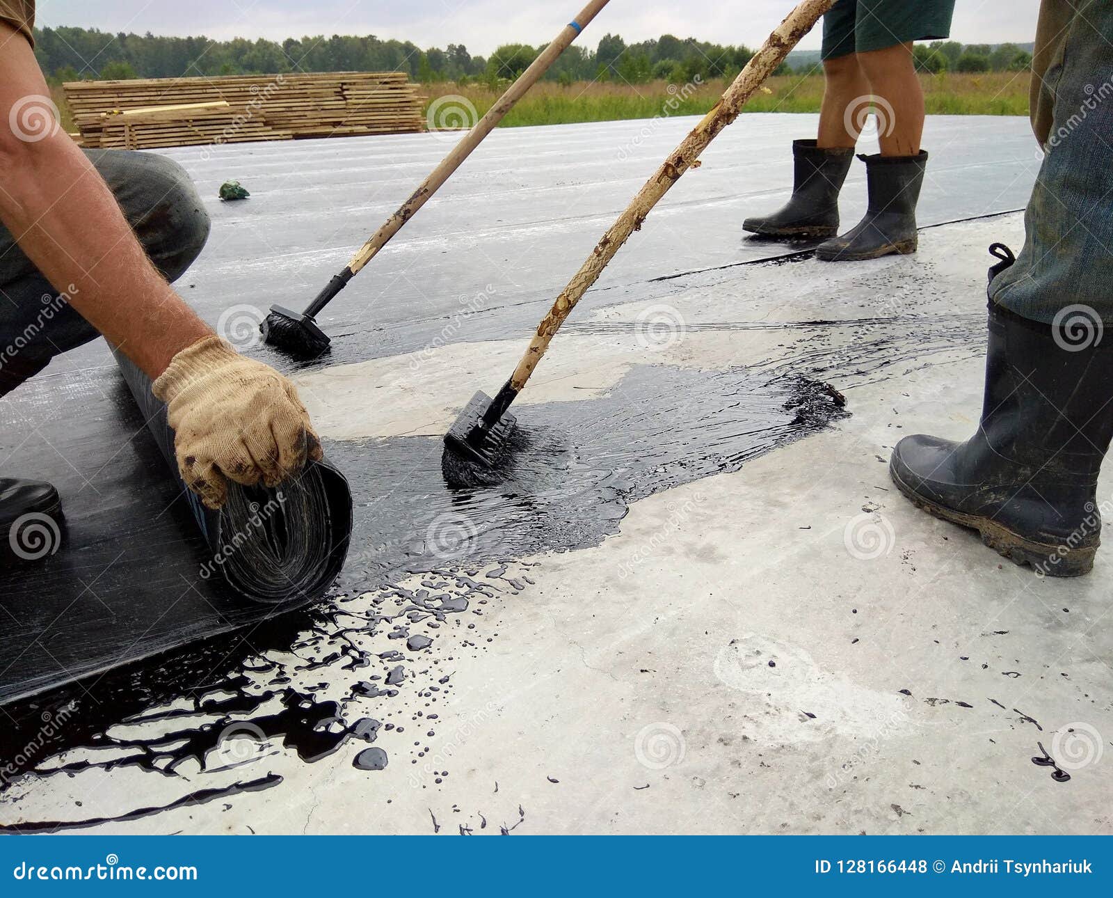 Roofer Worker Painting Bitumen Praimer at Concrete Surface by the ...