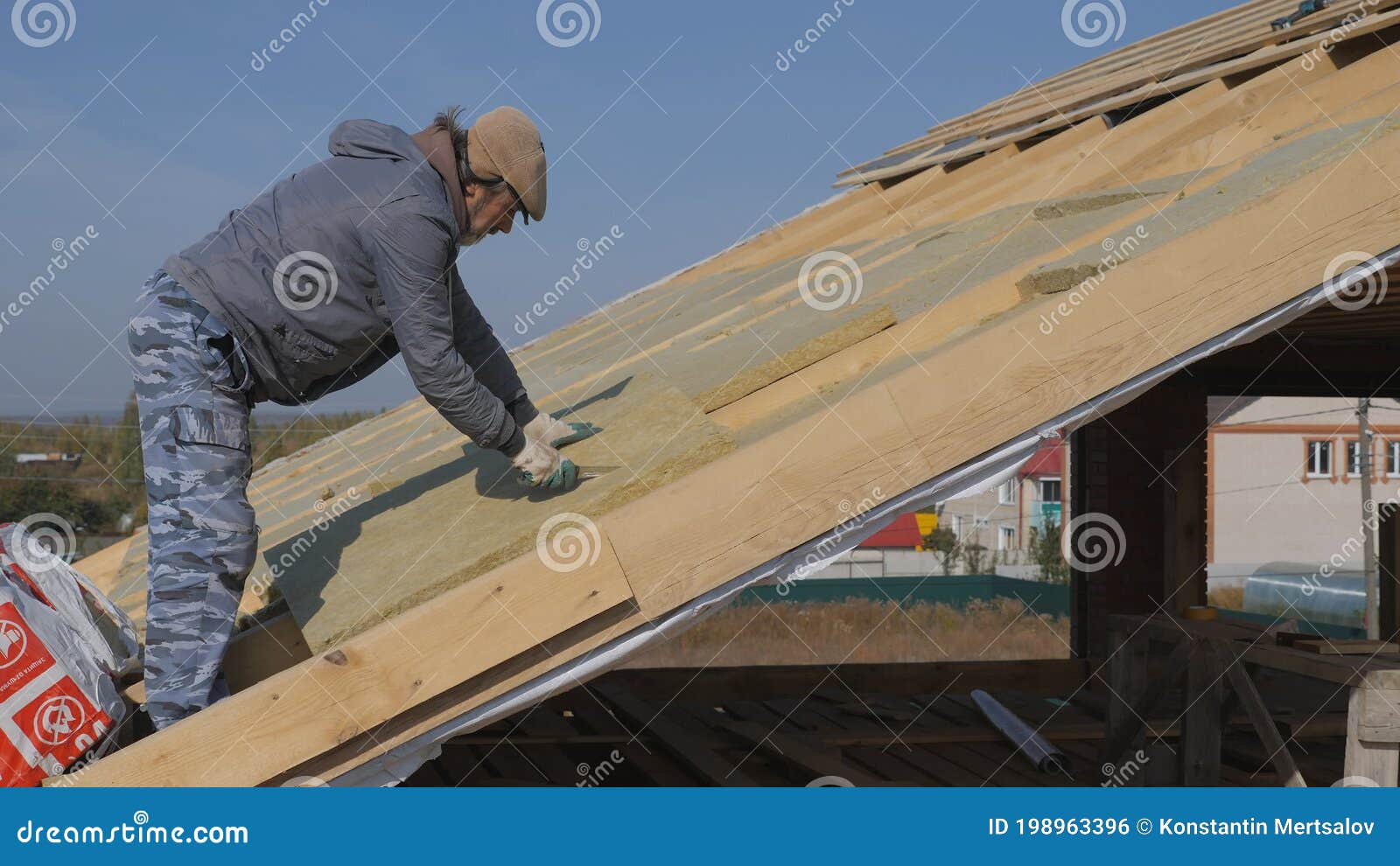 Roofing Work. Installation of Insulation for Insulation of the Roof of ...