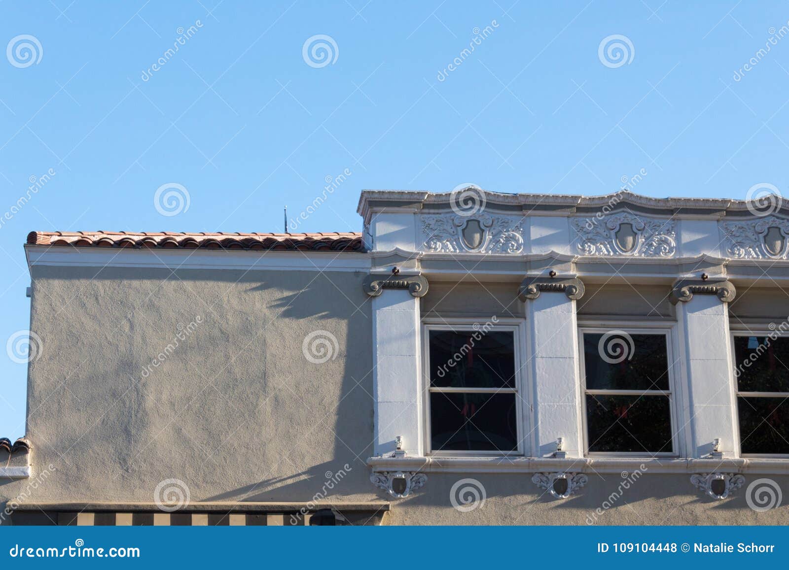 Roofline of a Building with Both Plain Stucco and Ornamental Window ...
