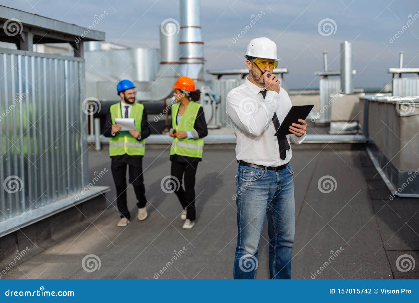 On the Rooftop of Construction Site Man Engineer Make a Conversation ...
