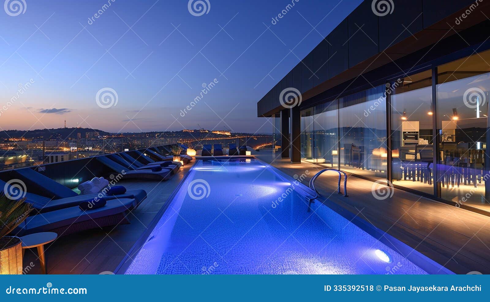 Rooftop Pool Featuring Loungers and Ambient Lighting with Stunning ...