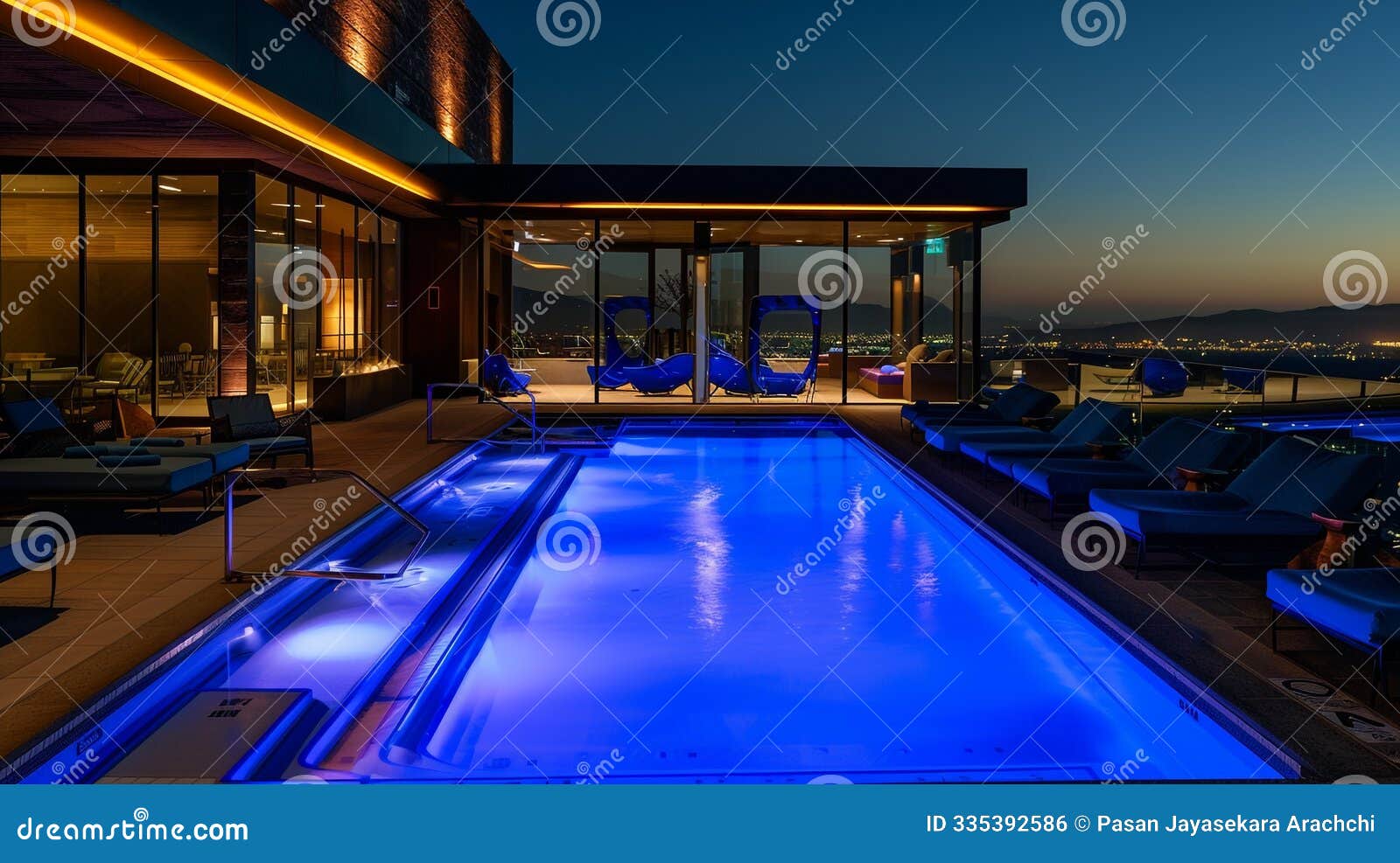Rooftop Pool Featuring Loungers with Ambient Lighting and Stunning ...