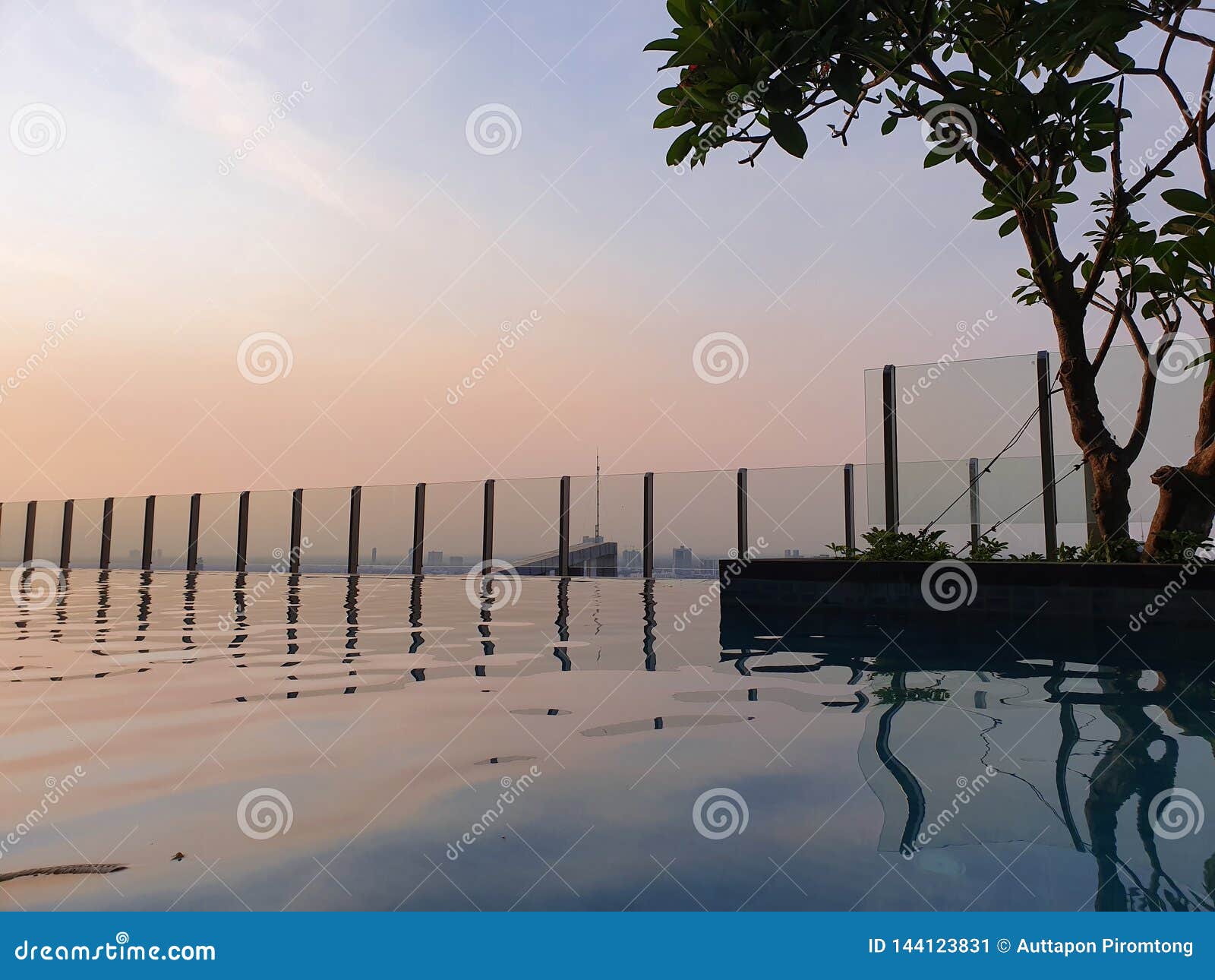 Rooftop pool. stock image. Image of rooftop, light, sunset - 144123831