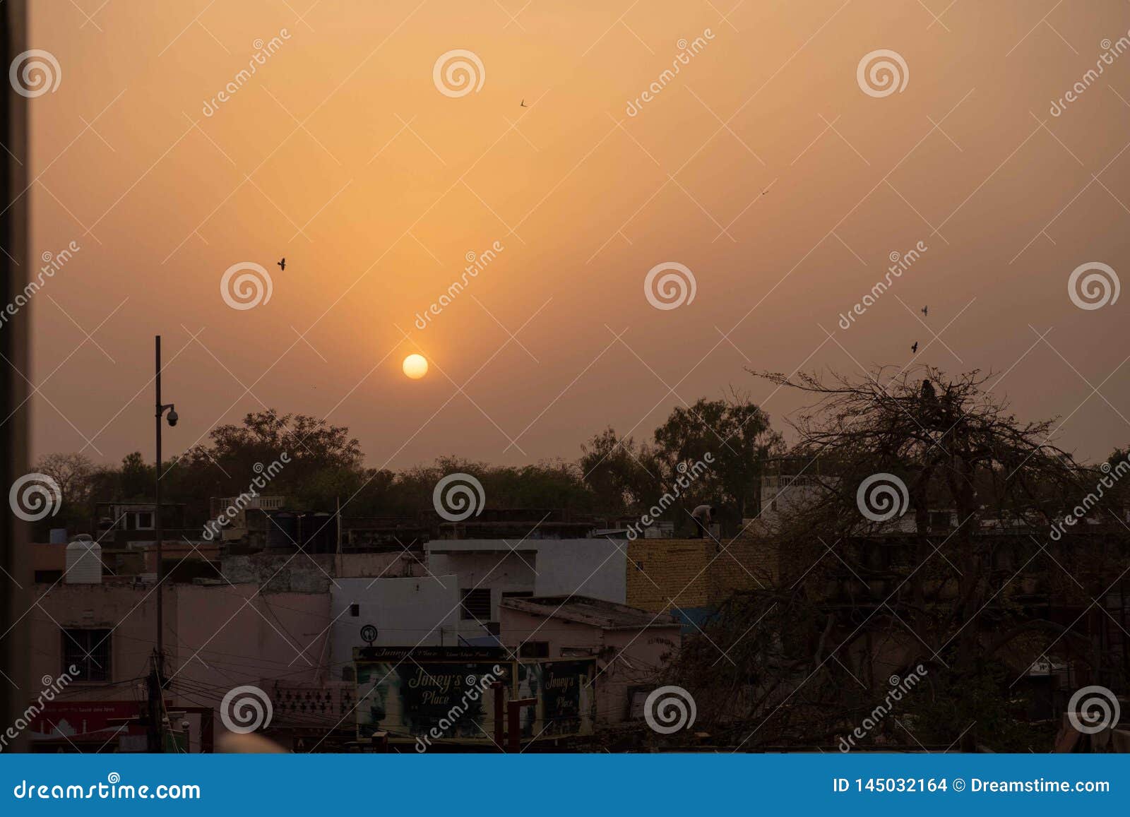 A rooftop sunset in Agra. editorial stock image. Image of jump - 145032164