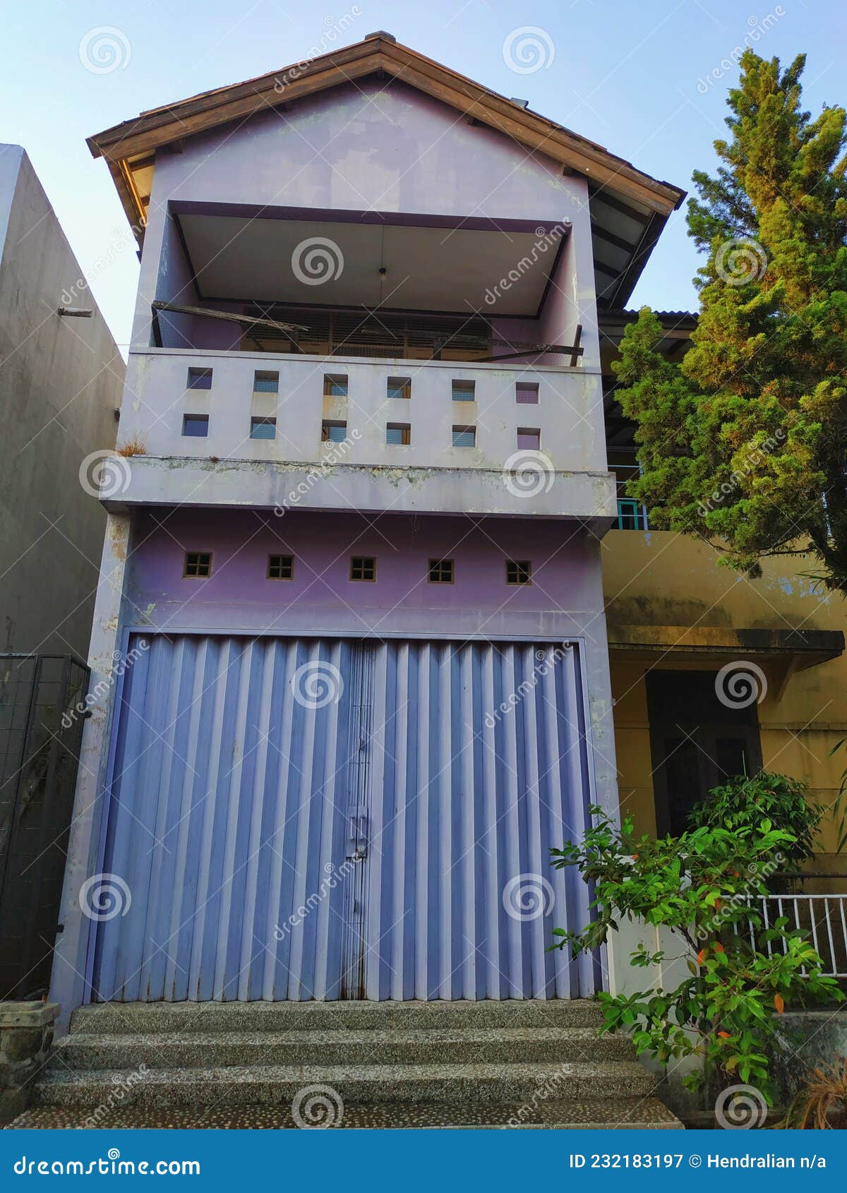 A Room at the Back of the House with a Light Purple Folding Gate. Stock ...