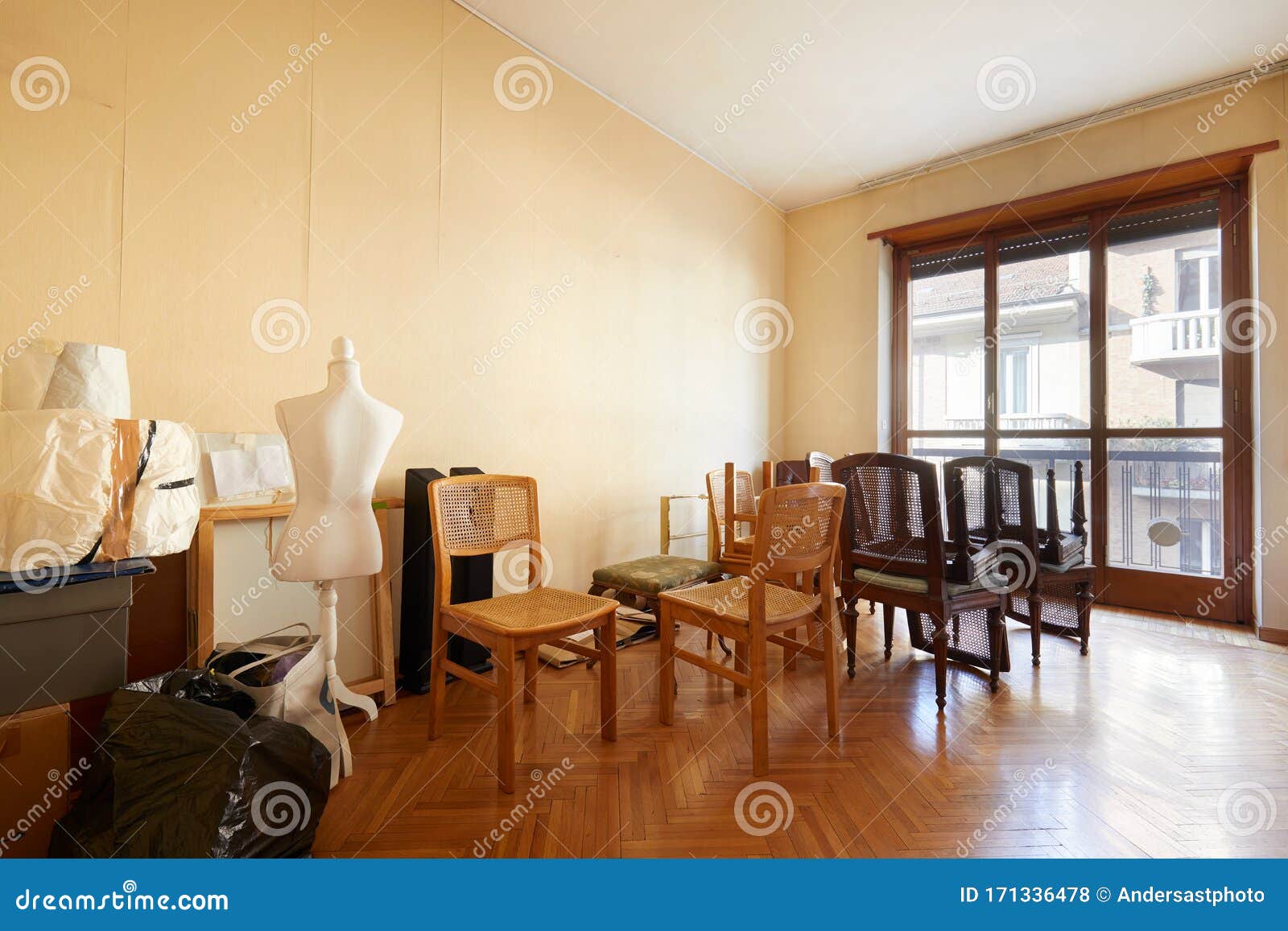 Room with Chairs, Boxes and a Tailor Dummy before Moving House Stock ...