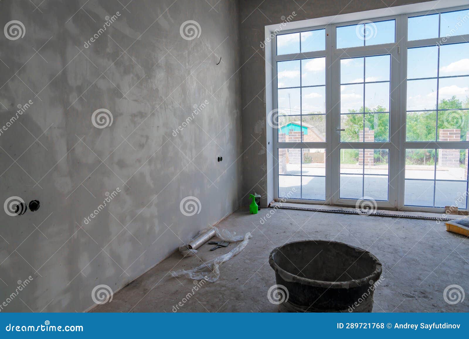 A Room with a Large Window in a House Under Construction. Stock Photo ...