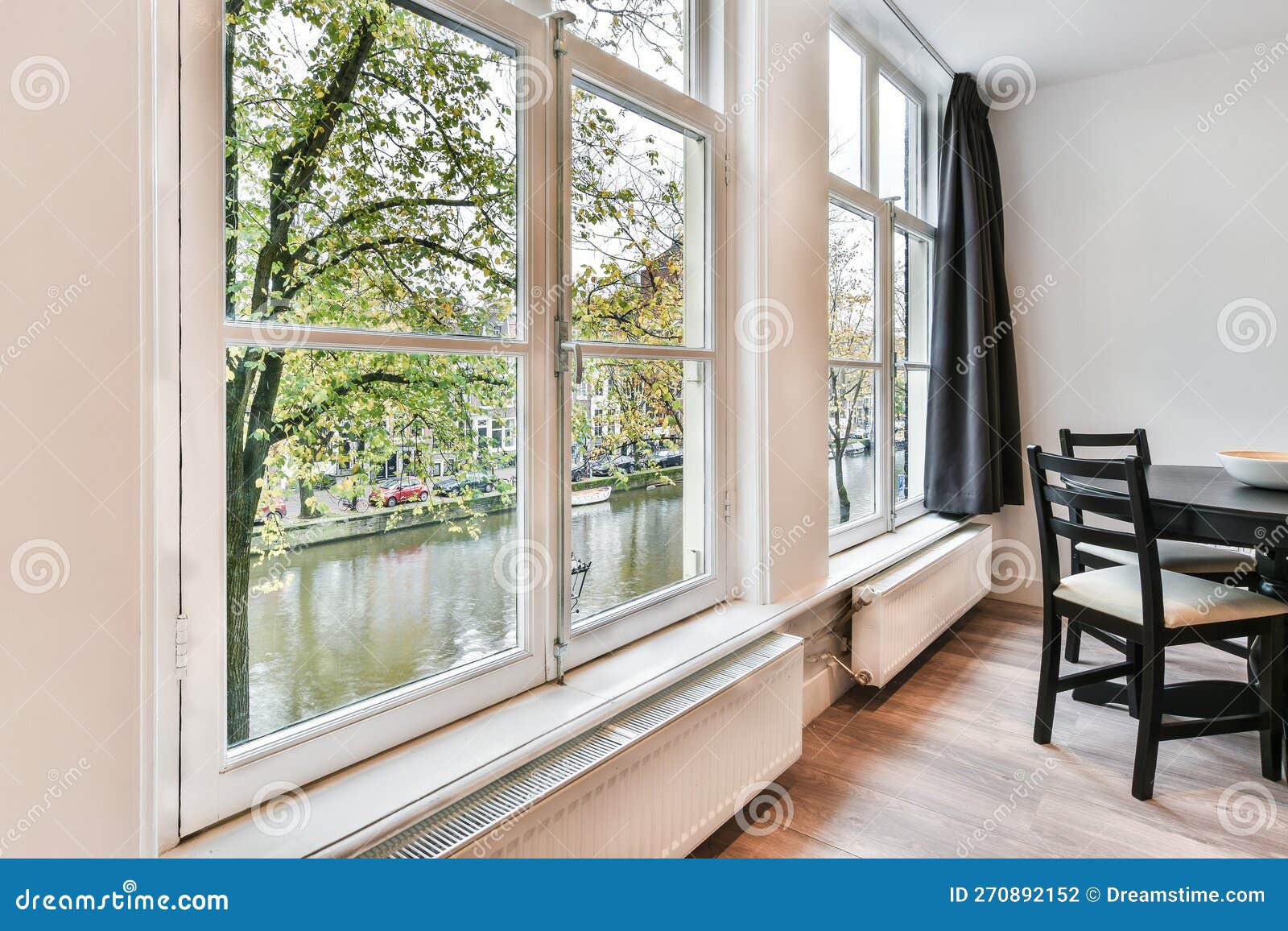 A Room with Large Windows and a Table and Chairs Editorial Photography ...
