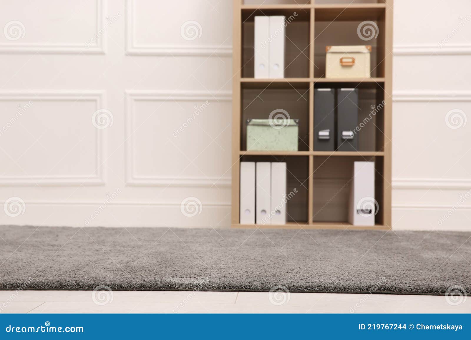 Room with Soft Grey Carpet, Shelving Rack and White Wall. Space for ...