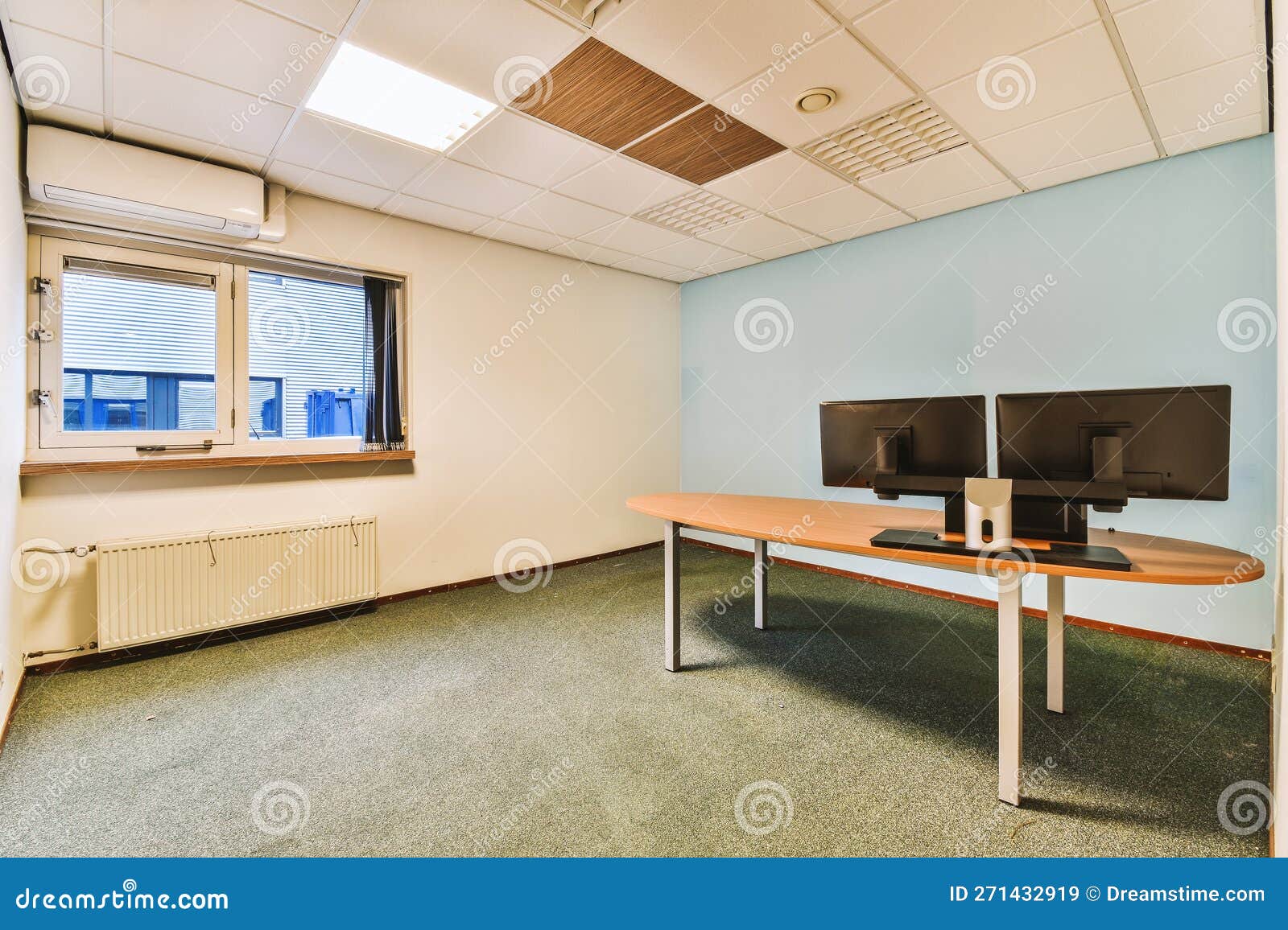 A Room with a Table with Two Monitors on it Stock Image - Image of ...