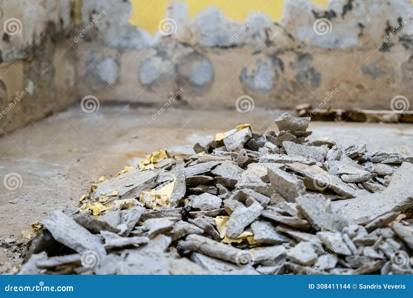 A Room Under Renovation with Debris of Broken Walls and Plaster on the ...