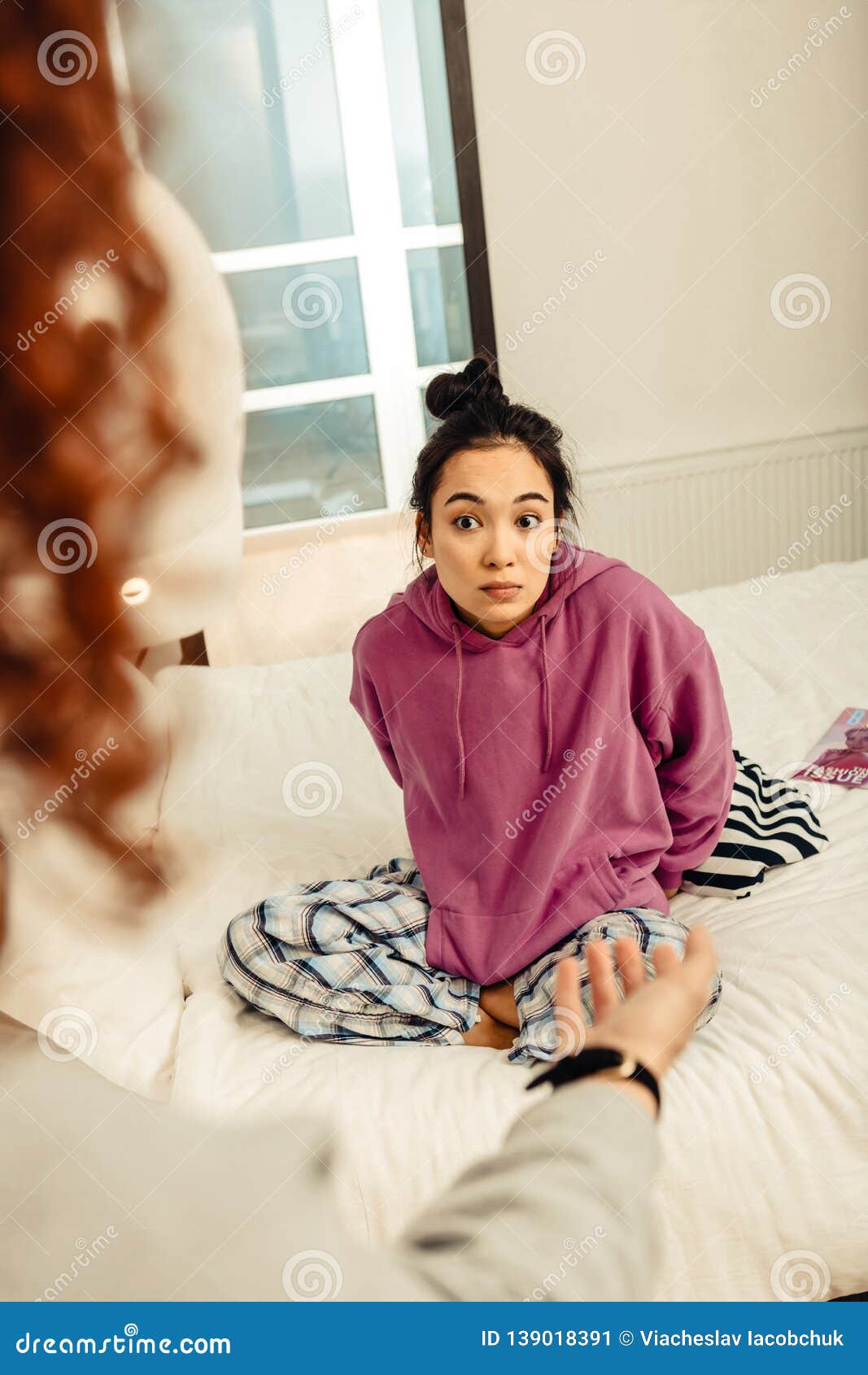 Roommate Feeling Embarrassed after Using Clothes of Her Friend Stock ...