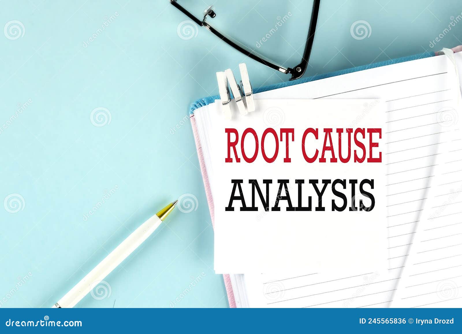 ROOT CAUSE ANALYSIS Text on a Sticky on Notebook with Pen and Glasses ...