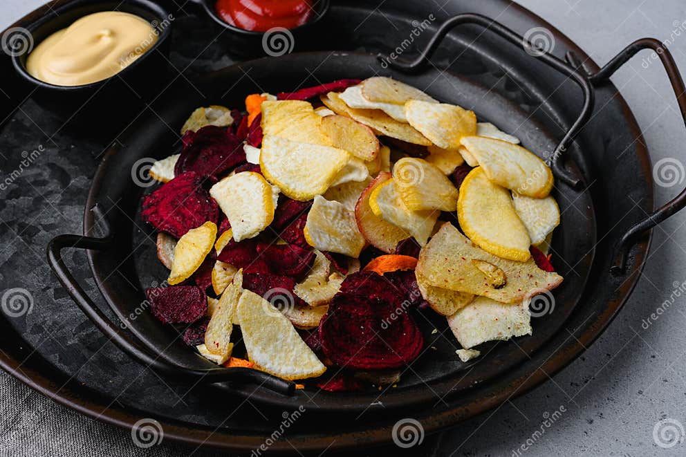 Root Vegetable Crisps, on Gray Stone Table Background Stock Image ...