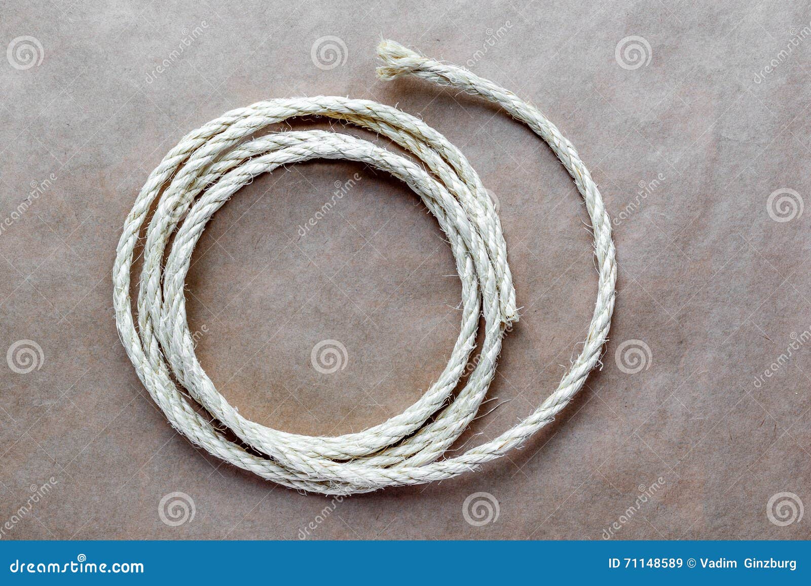 Rope Coiled at Kraft Paper on the Background Stock Image - Image of ...