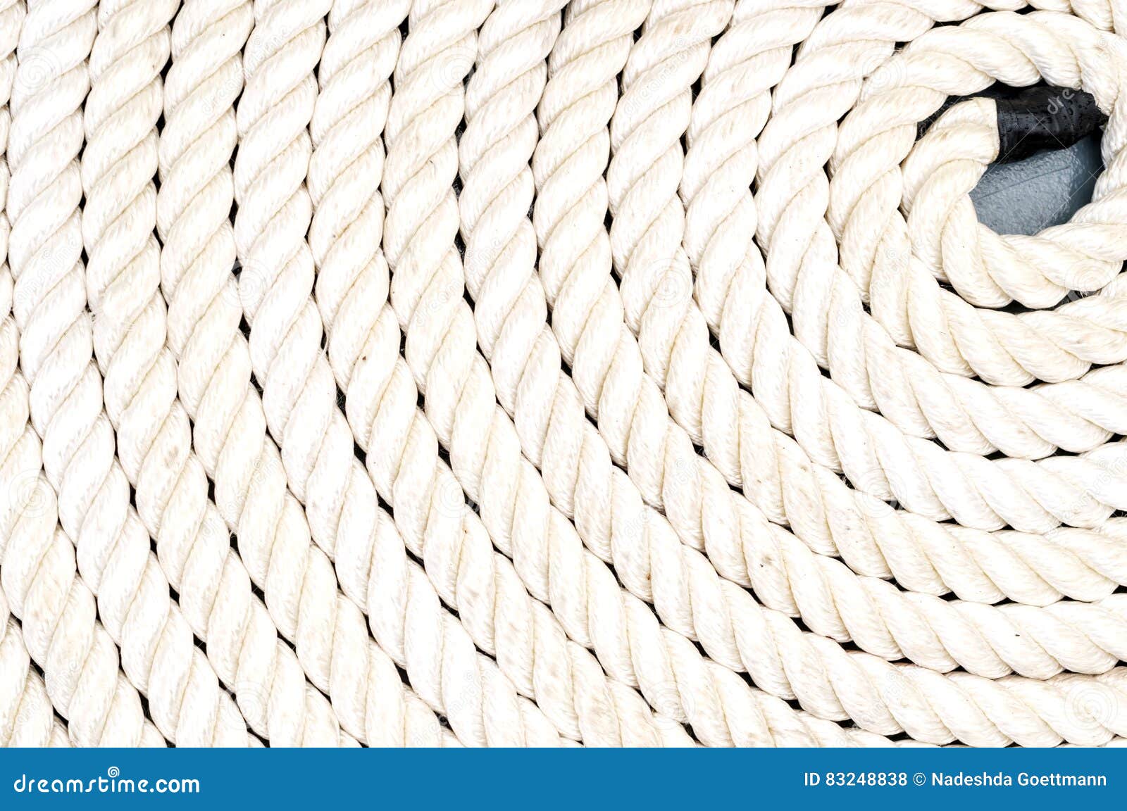 Rope coiled up in circles stock photo. Image of isolated - 83248838