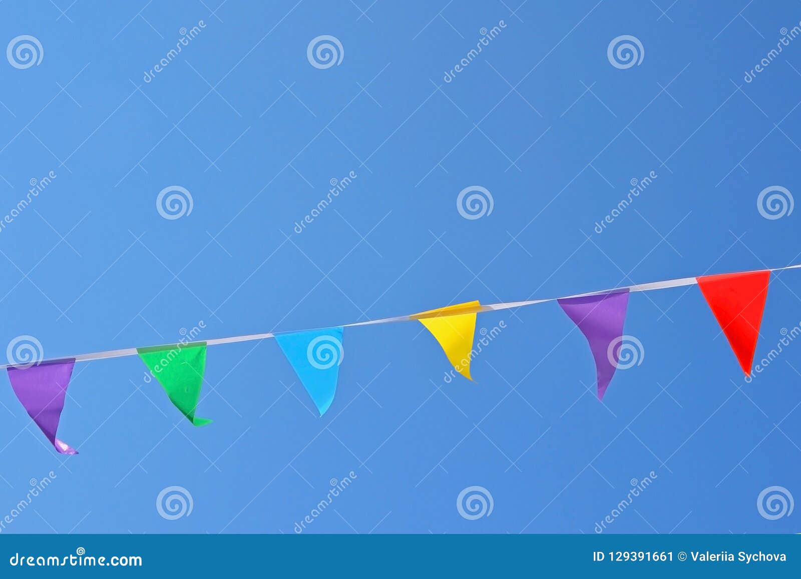 Rope with Colored Flags Hanging on Blue Sky Background Stock Image ...