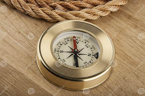 Rope and Compass on a Wooden Stock Image - Image of design, compass ...